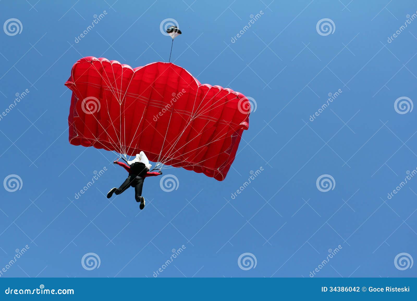 Parachutist with Red Parachute Stock Photo - Image of diving ...