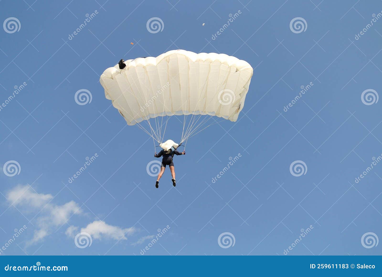 Parachuter with White Parachute on Parachuting Cup, Held in City ...