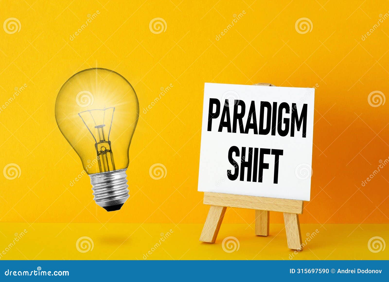 Paradigm Shift is Shown Using the Text and Photo of Light Bulb Stock ...