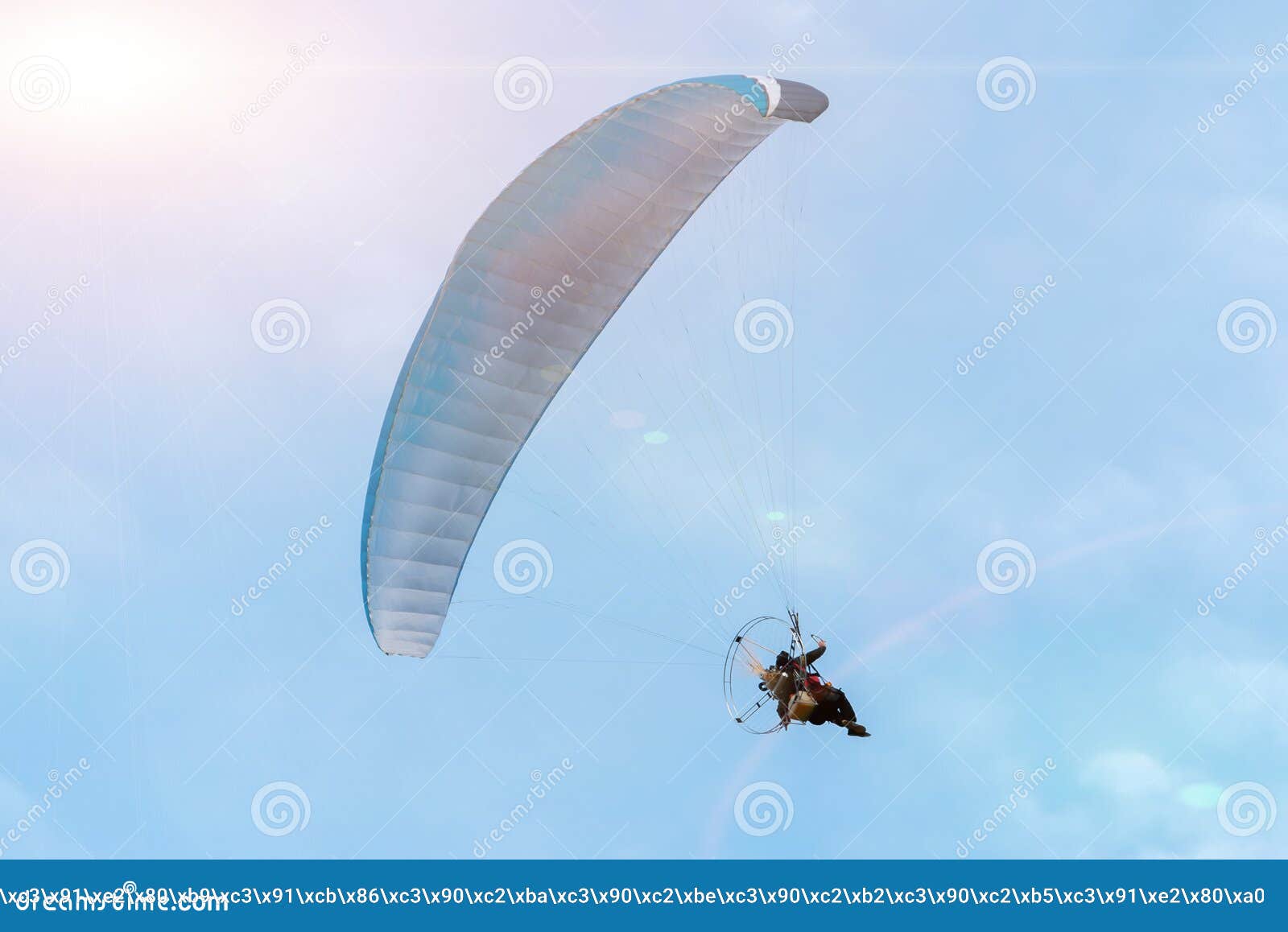 Paraglide with a Motor High in the Sky Stock Photo - Image of paramotor ...