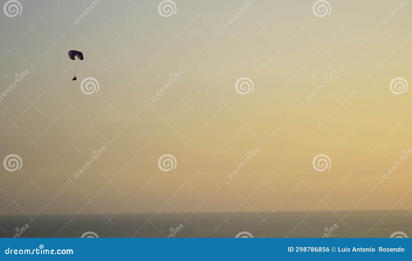 Paraglider Flying Over a Sunset without People in the Pacific Ocean ...