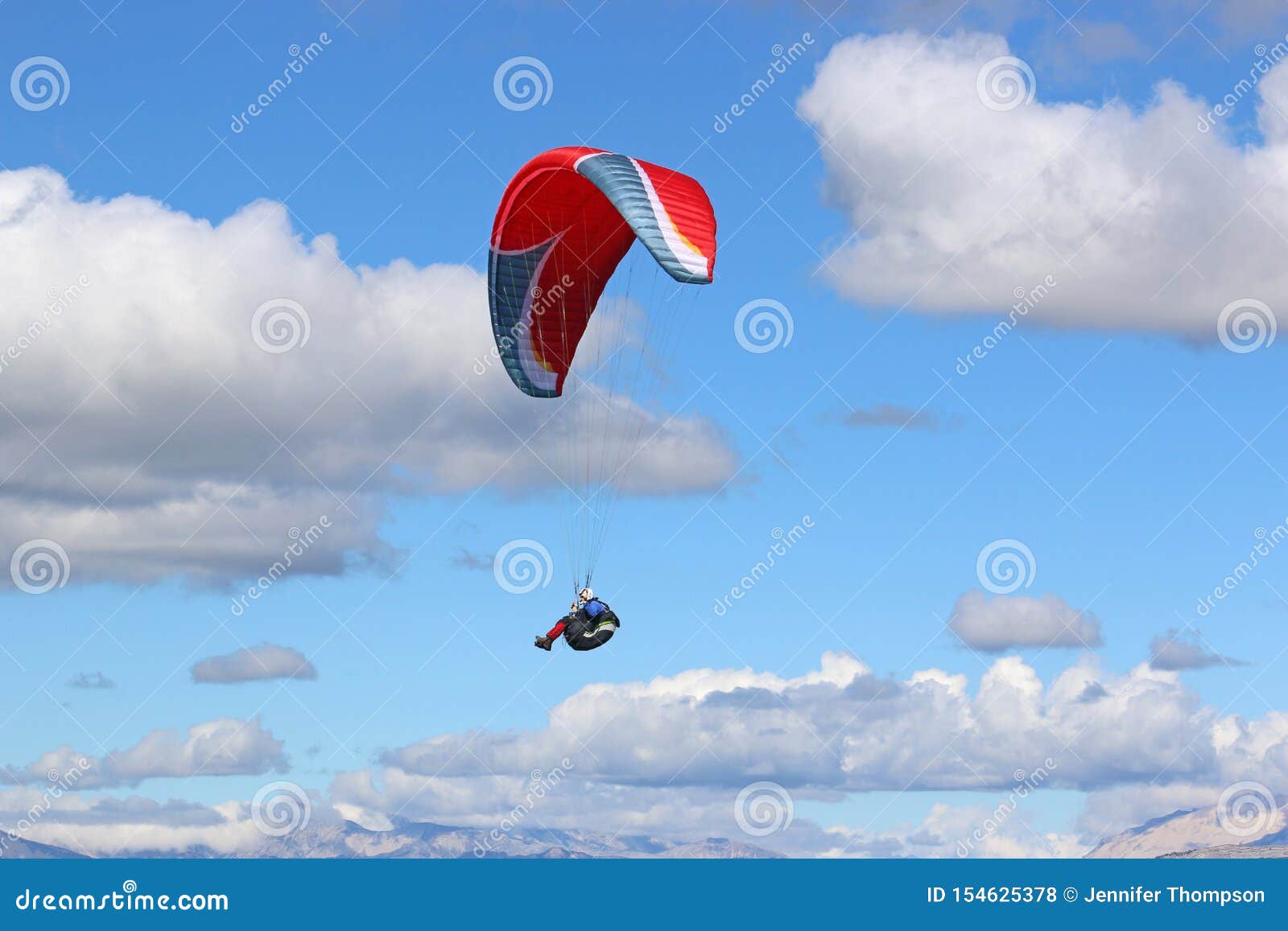 Red Paraglider in a Blue Sky Stock Photo - Image of harness, flyer ...