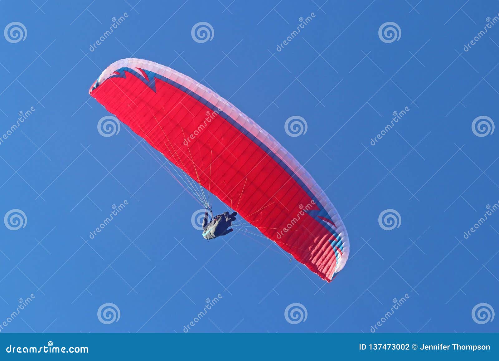 Paraglider flying red wing stock photo. Image of wing - 137473002
