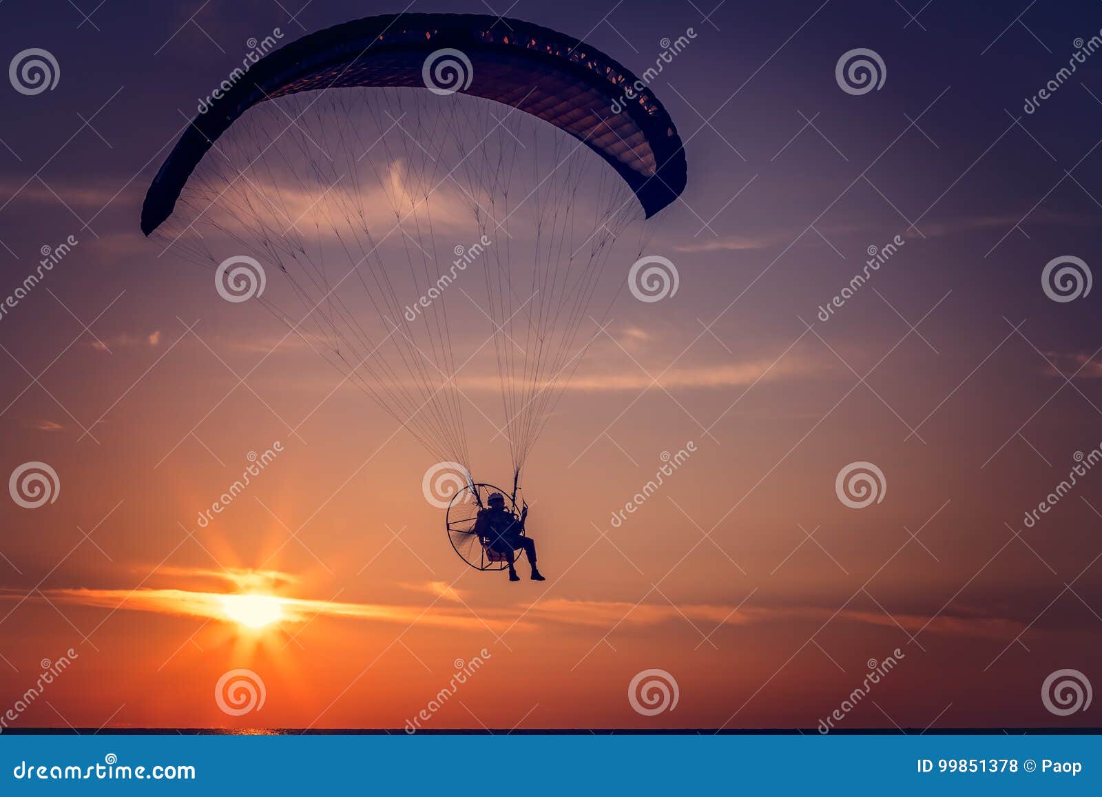 Paraglider Flying at Sunset Stock Photo - Image of excitement, engine ...