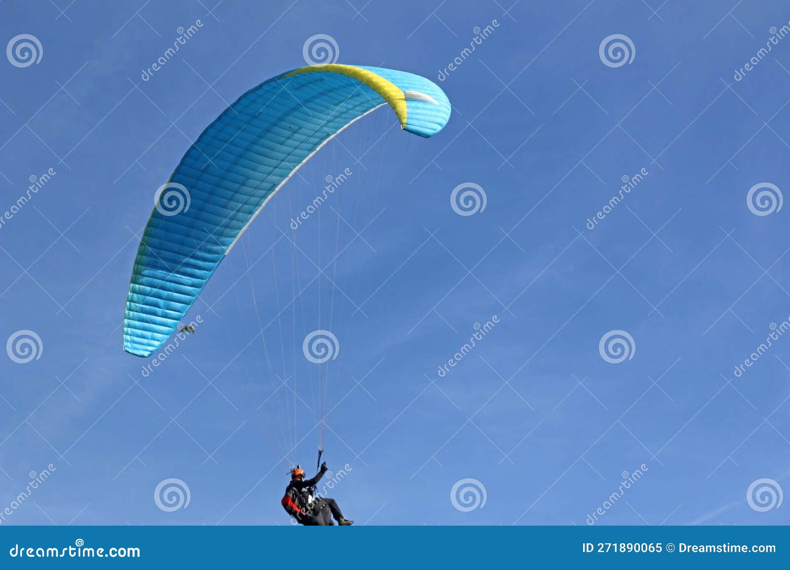 Paraglider Flying in a Blue Sky Stock Image - Image of flier, lines ...