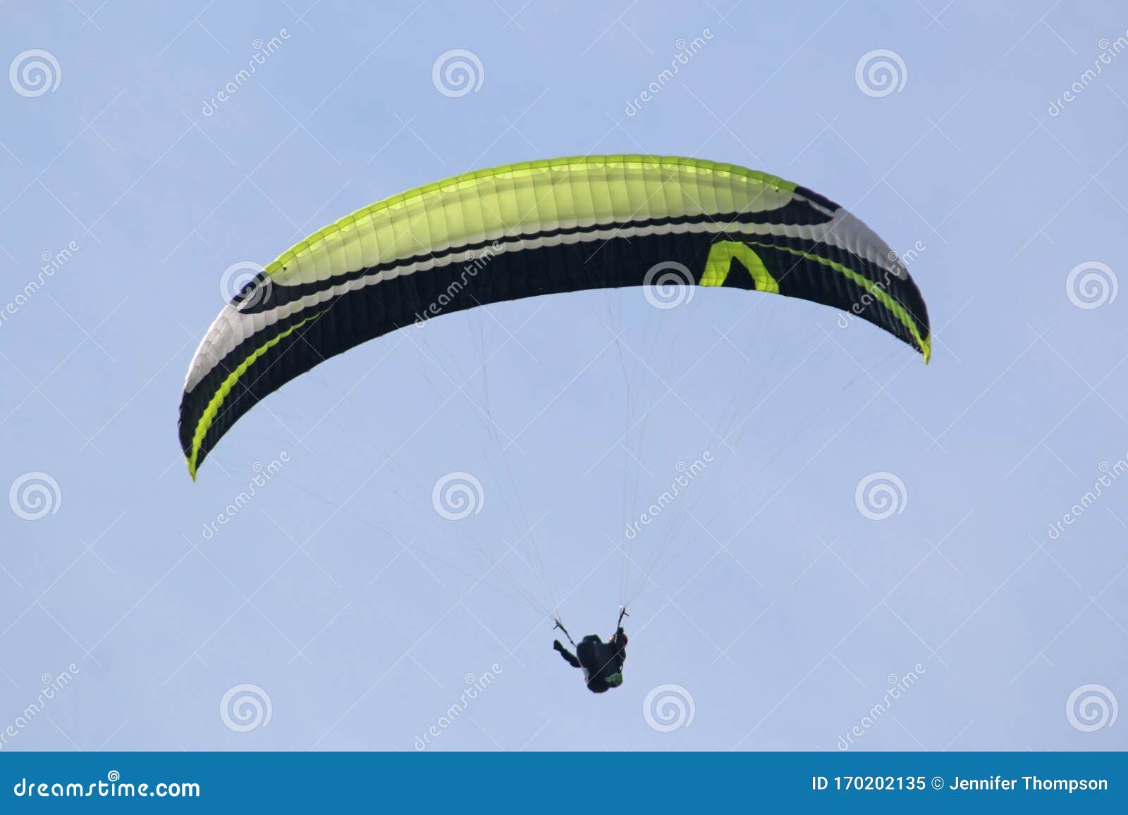 Paraglider Flying Wing in a Blue Sky Stock Image - Image of paraglider ...