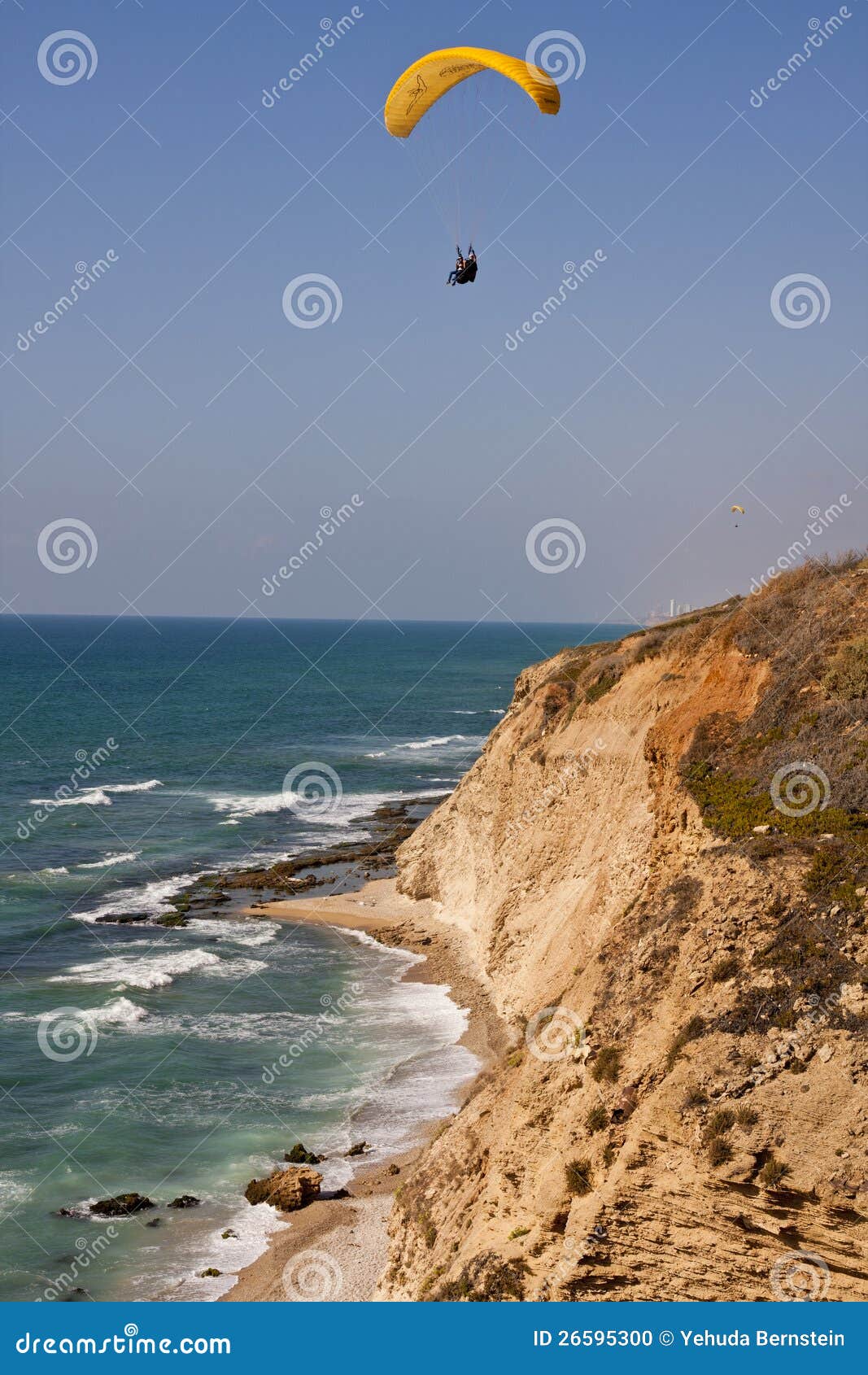 Paraglider over a cliff editorial image. Image of high - 26595300
