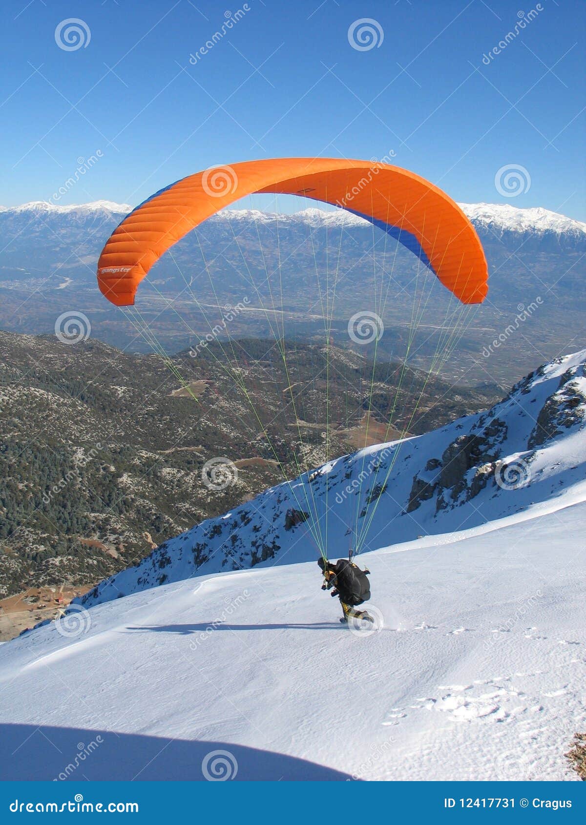 Paraglider snow launch stock image. Image of blue, orange - 12417731