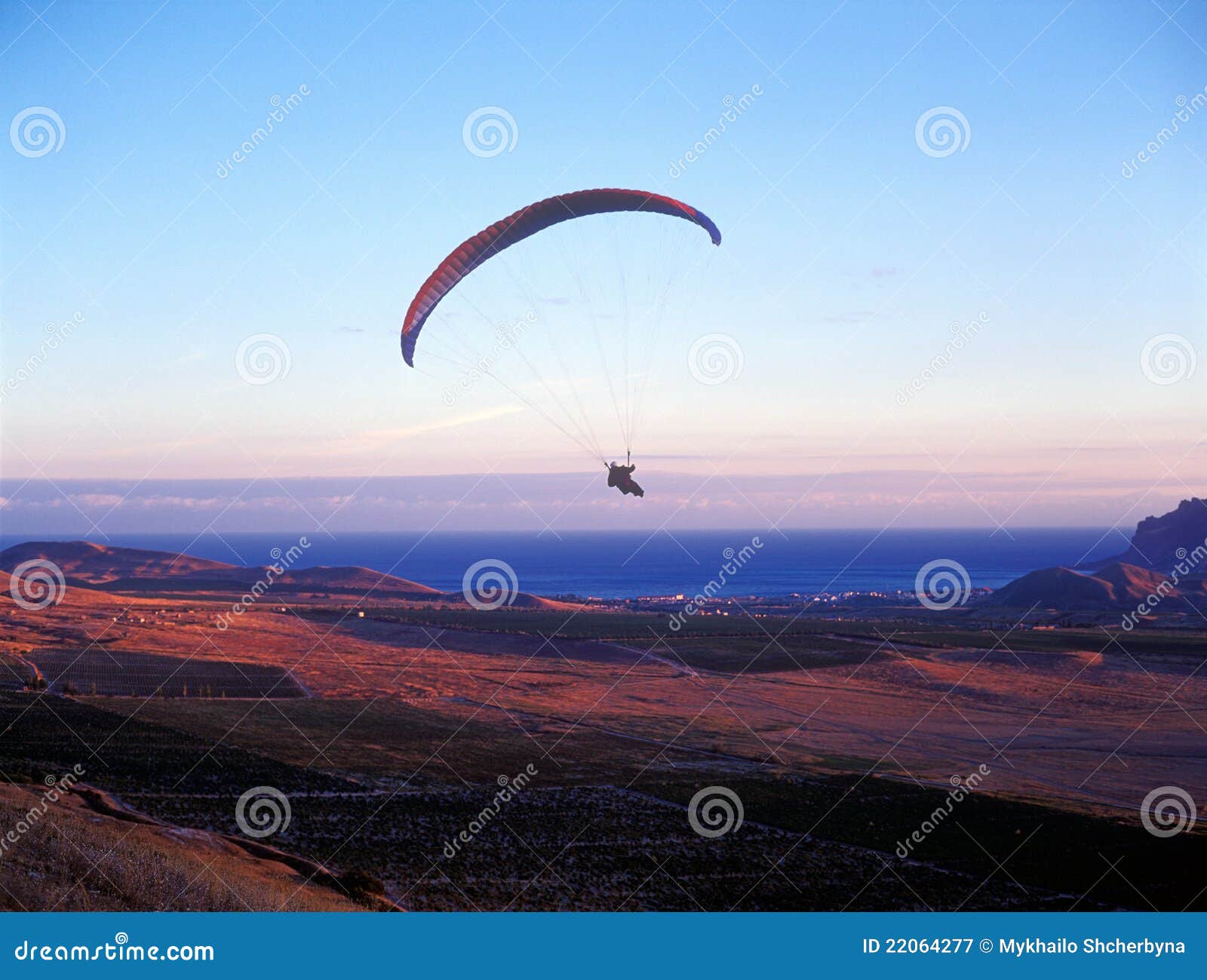 Paraglider at sunset. stock image. Image of paraglider - 22064277
