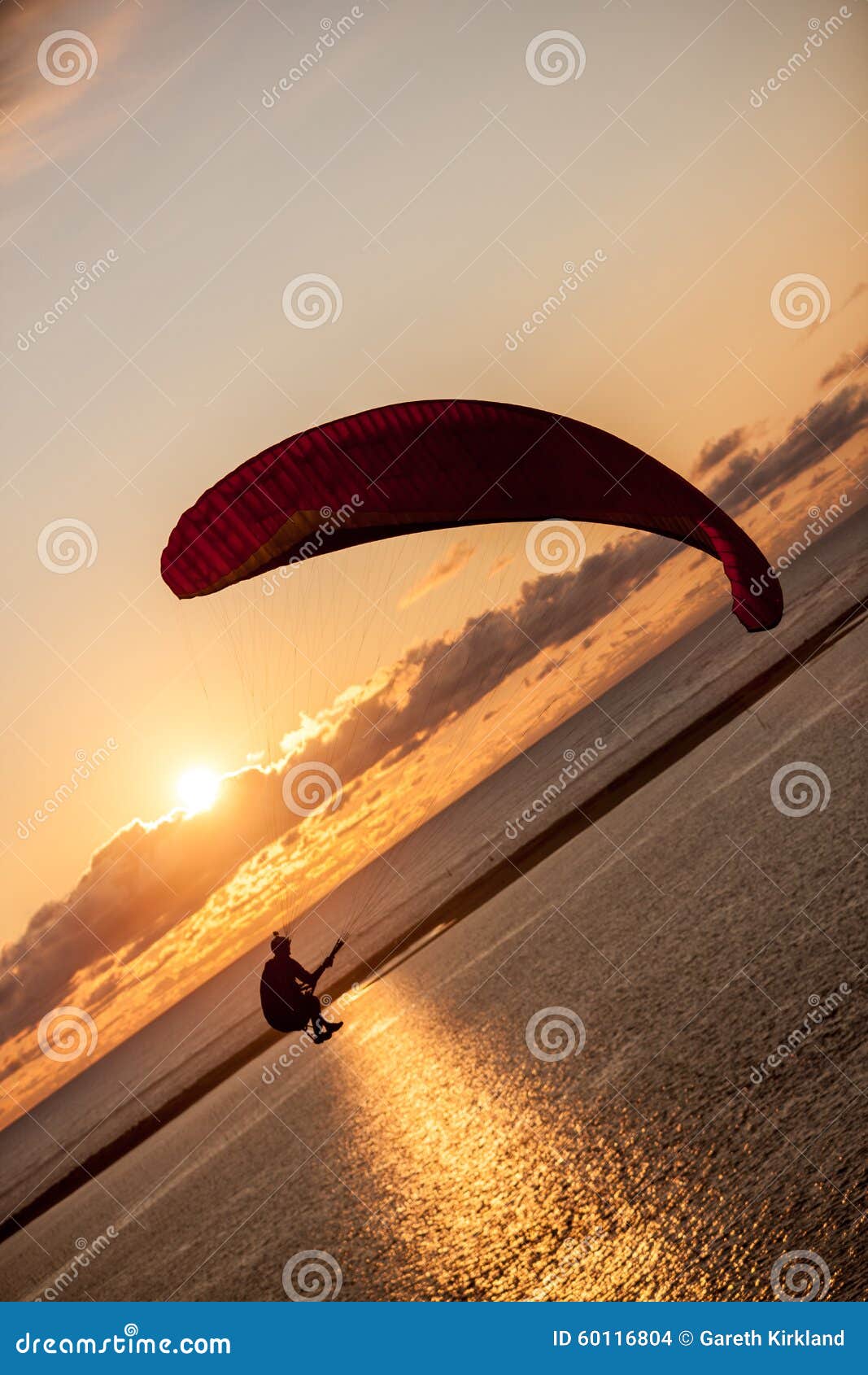 Paraglider at sunset stock photo. Image of paragliding - 60116804