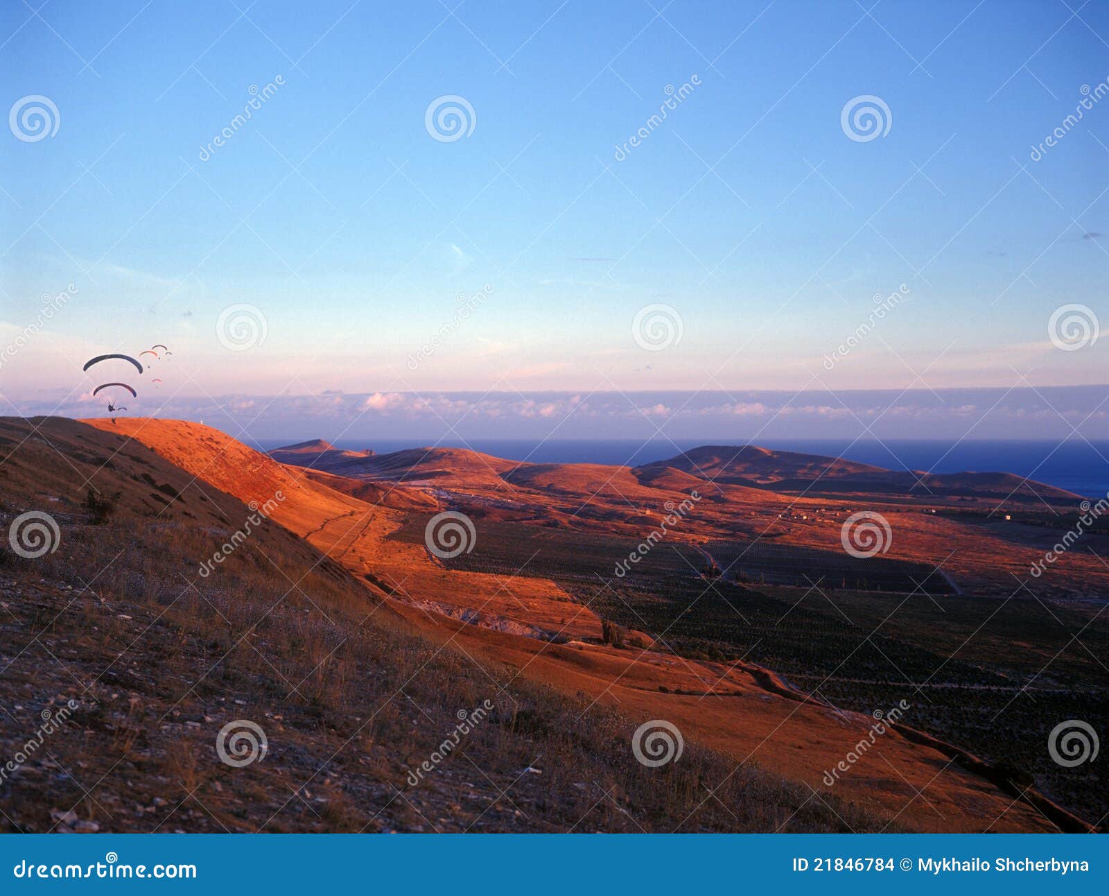 Paragliders at sunset. stock photo. Image of freedom - 21846784