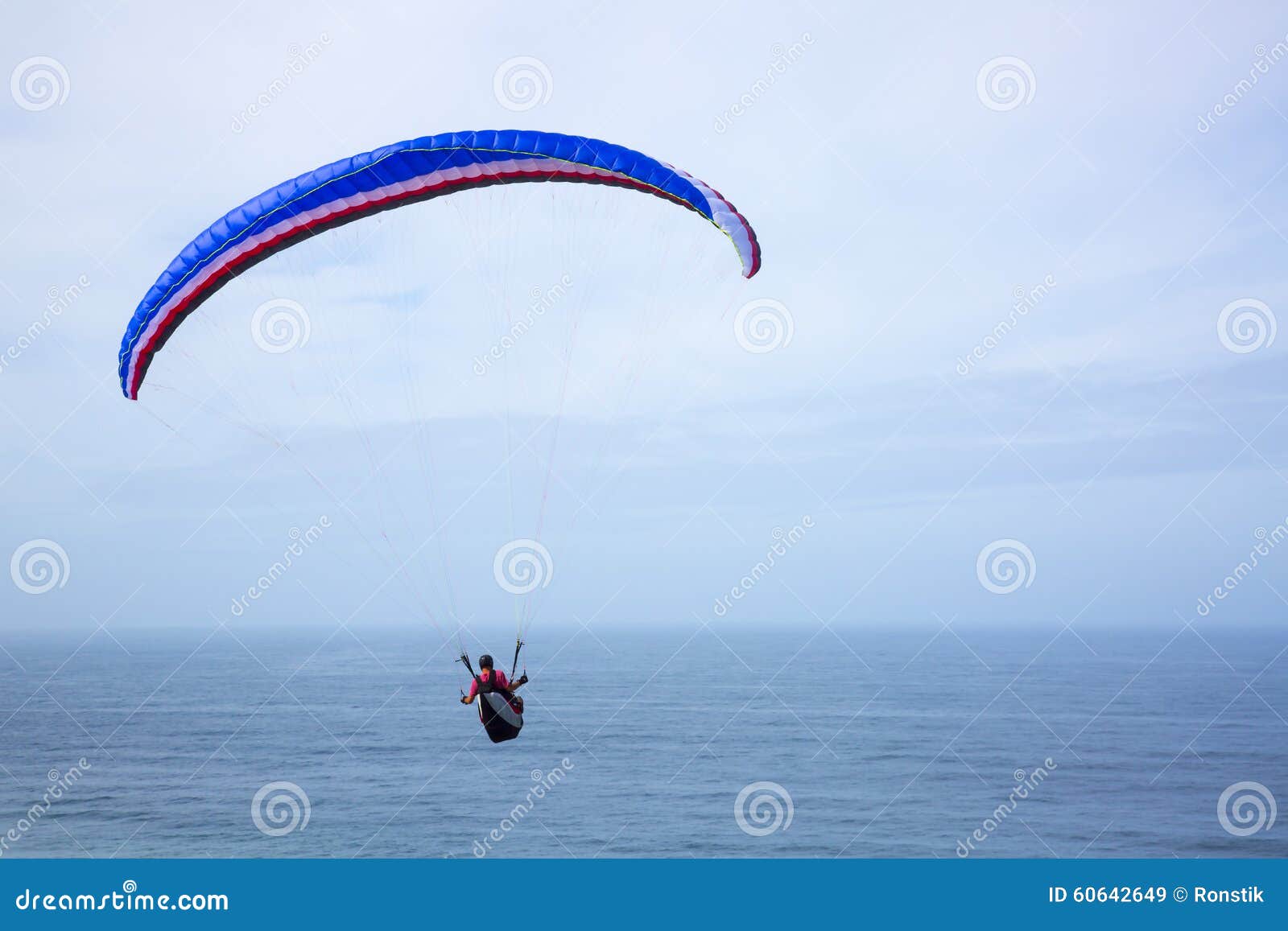 Paragliding Above the Ocean Stock Image - Image of paraglider, person ...