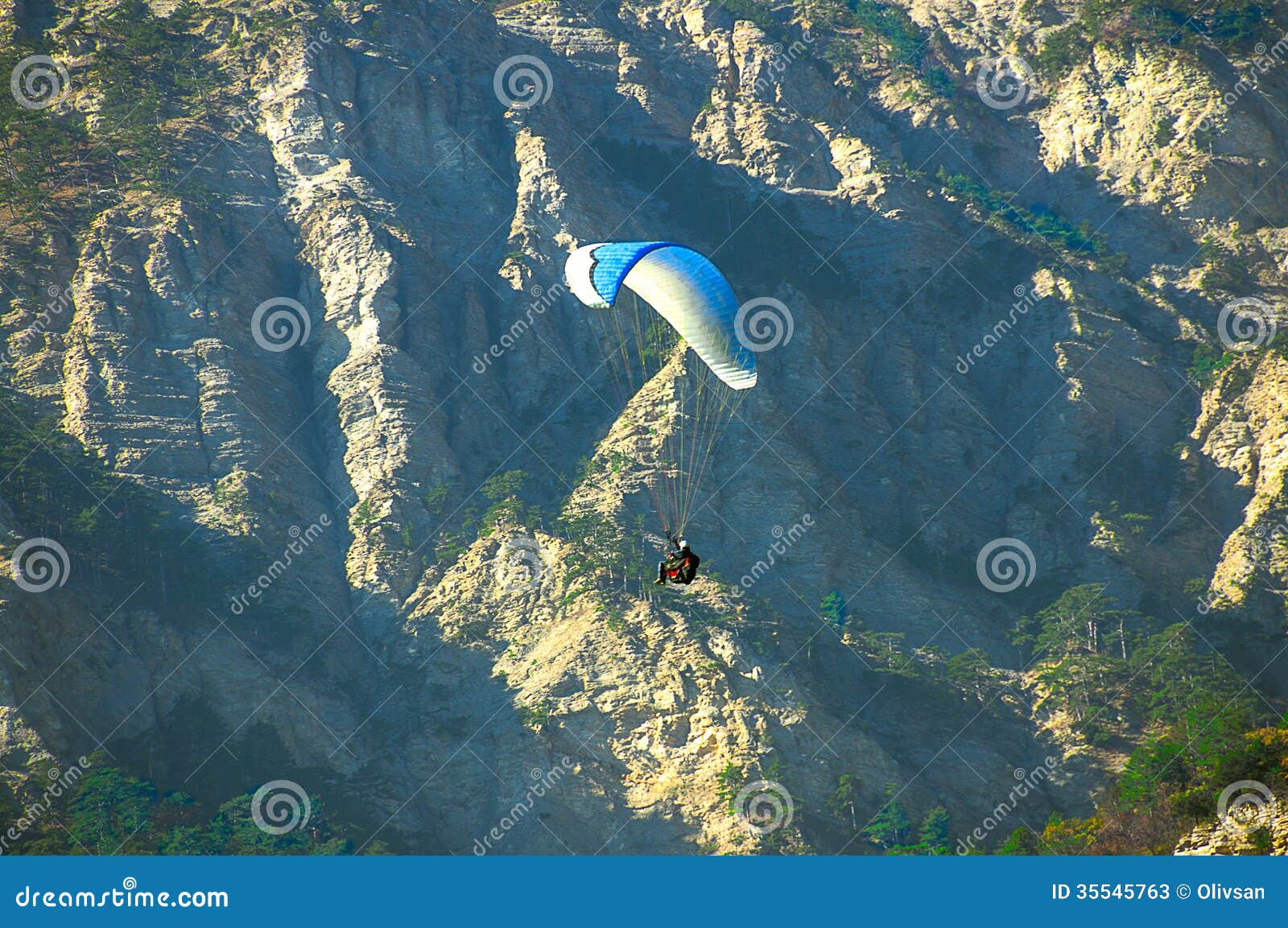 Paragliding Along the Rock Wall Stock Image - Image of pursuit ...