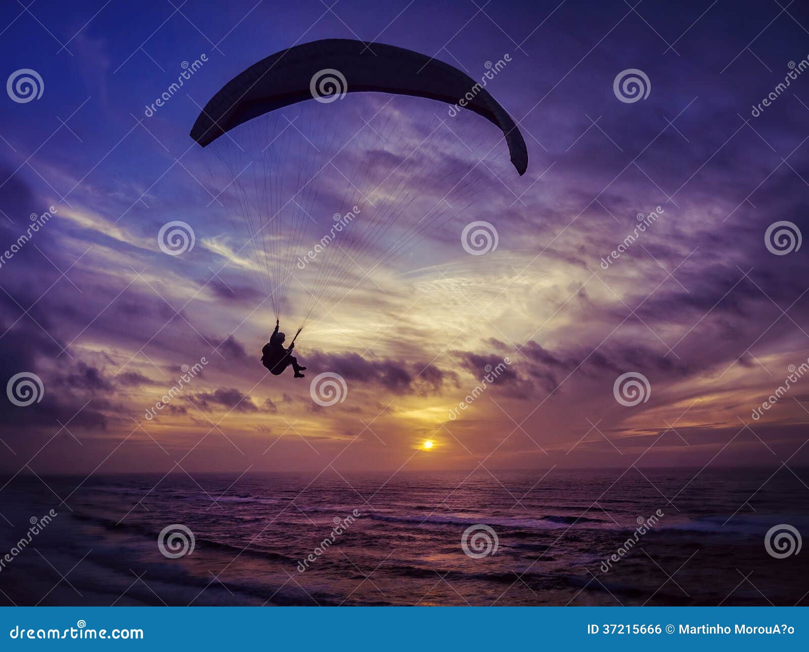 Paragliding Flight at Sunset Stock Photo - Image of birds, heights ...
