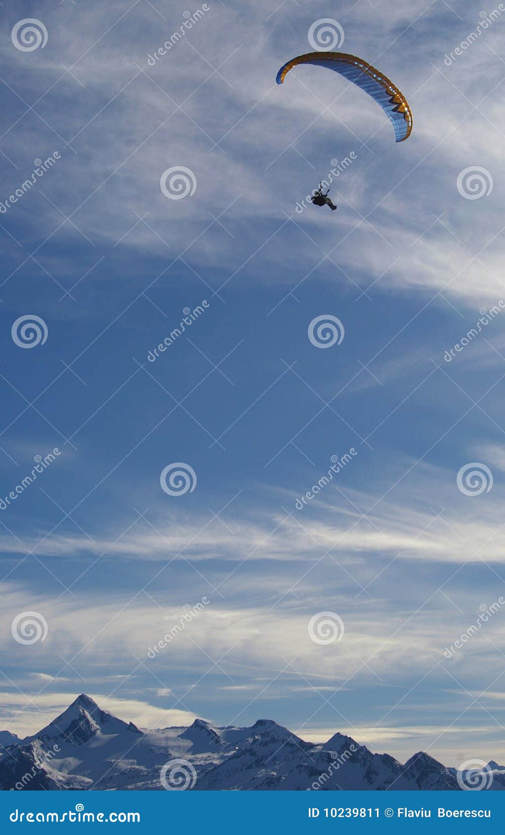 Paragliding over mountains stock image. Image of perspective - 10239811