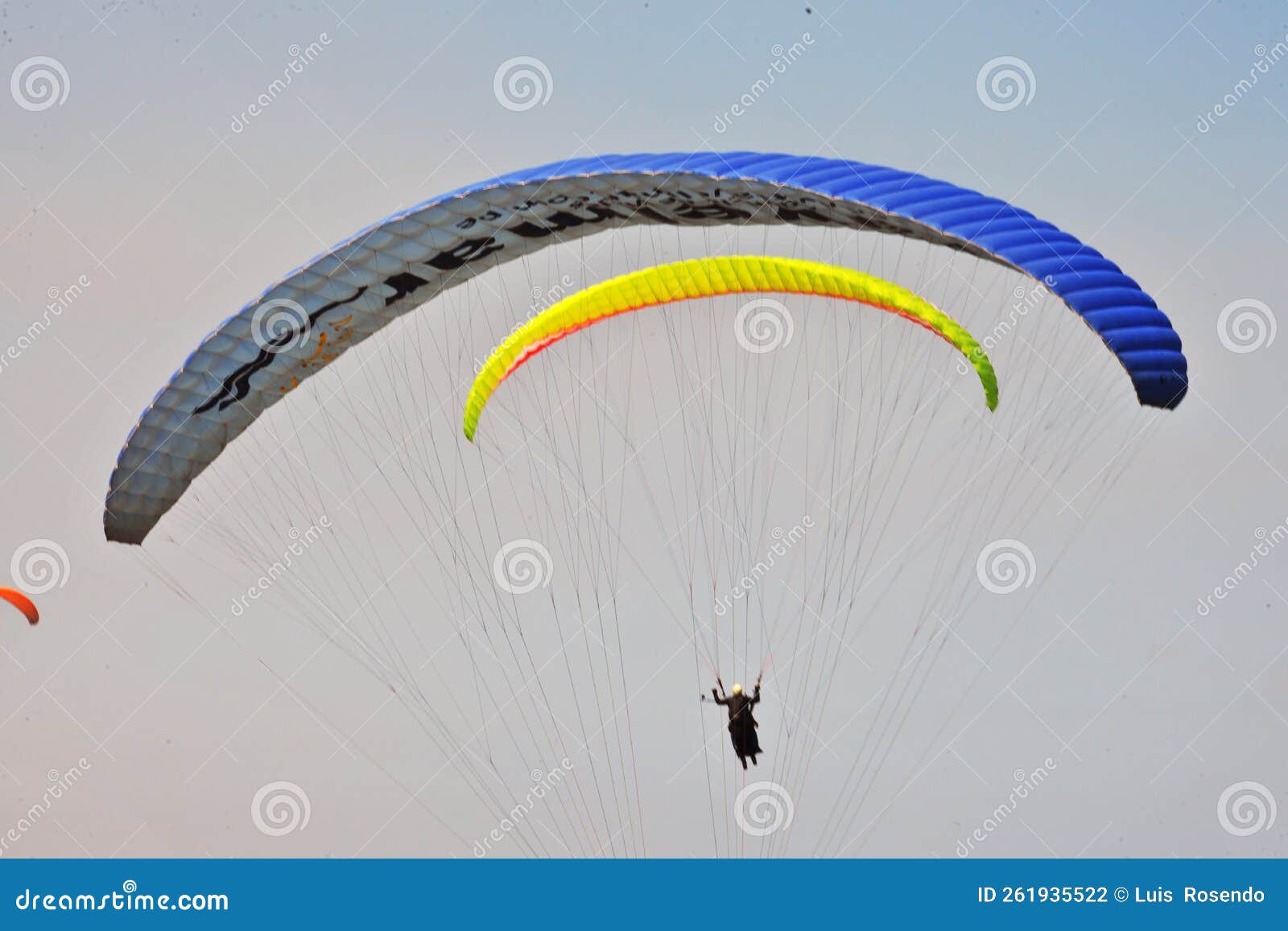 Paragliding Over the Ocean in the Bright Daylight Blue Sky Stock Photo ...