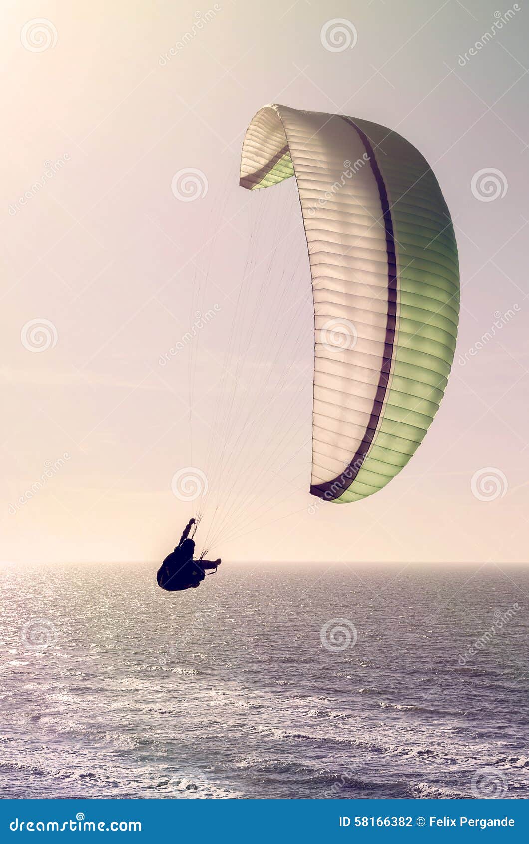 Paragliding over the ocean stock photo. Image of blue - 58166382
