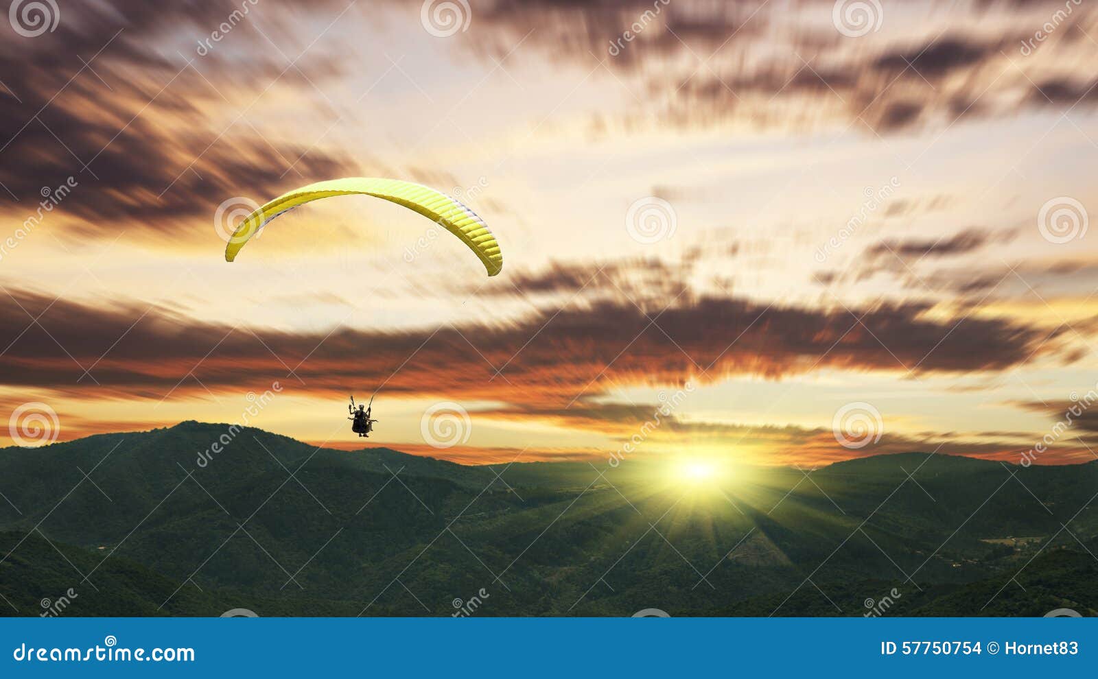 Paragliding at Sunset with Purple Clouds Stock Photo - Image of flying ...