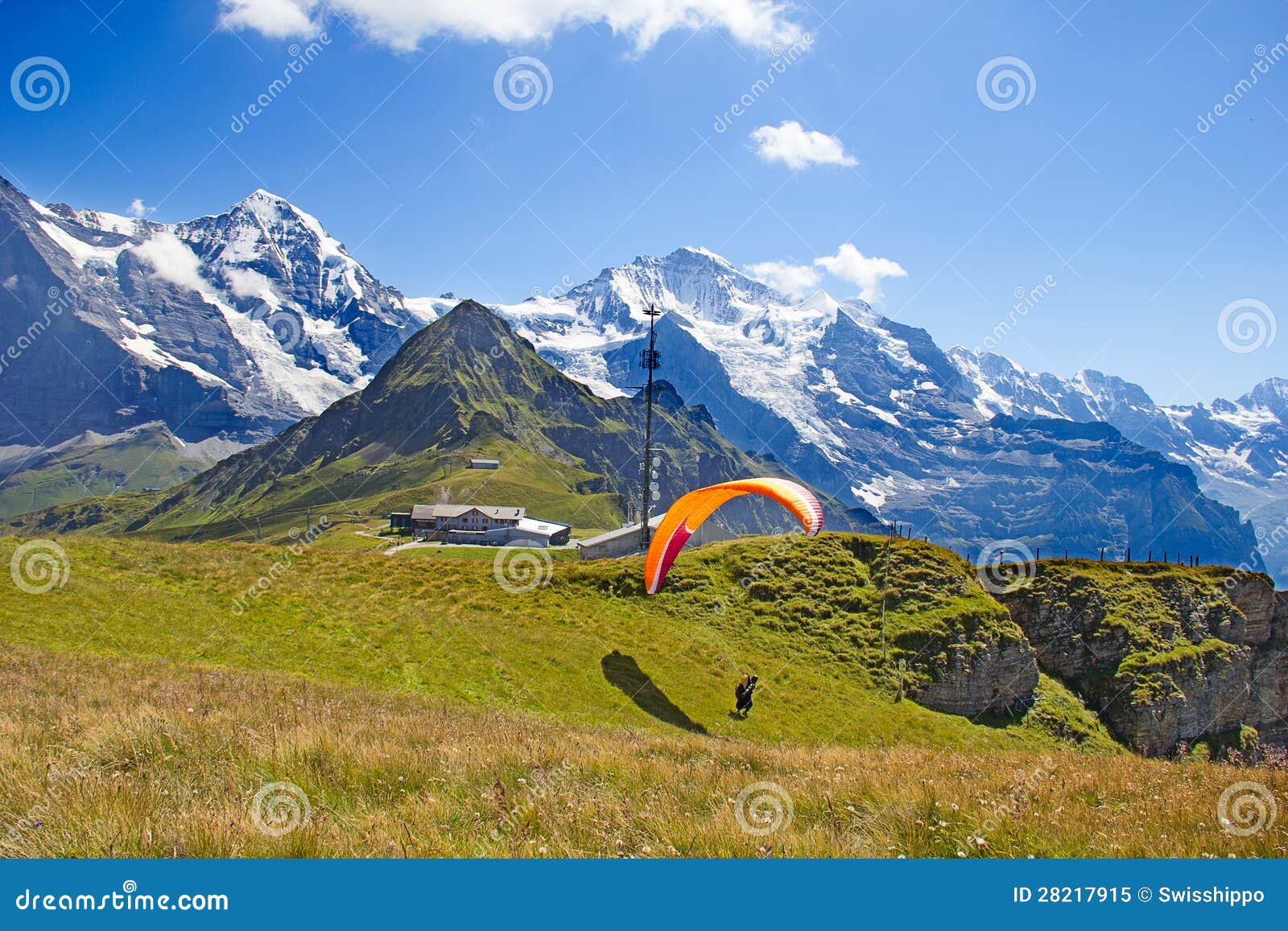 Paragliding in swiss alps stock image. Image of hobby - 28217915