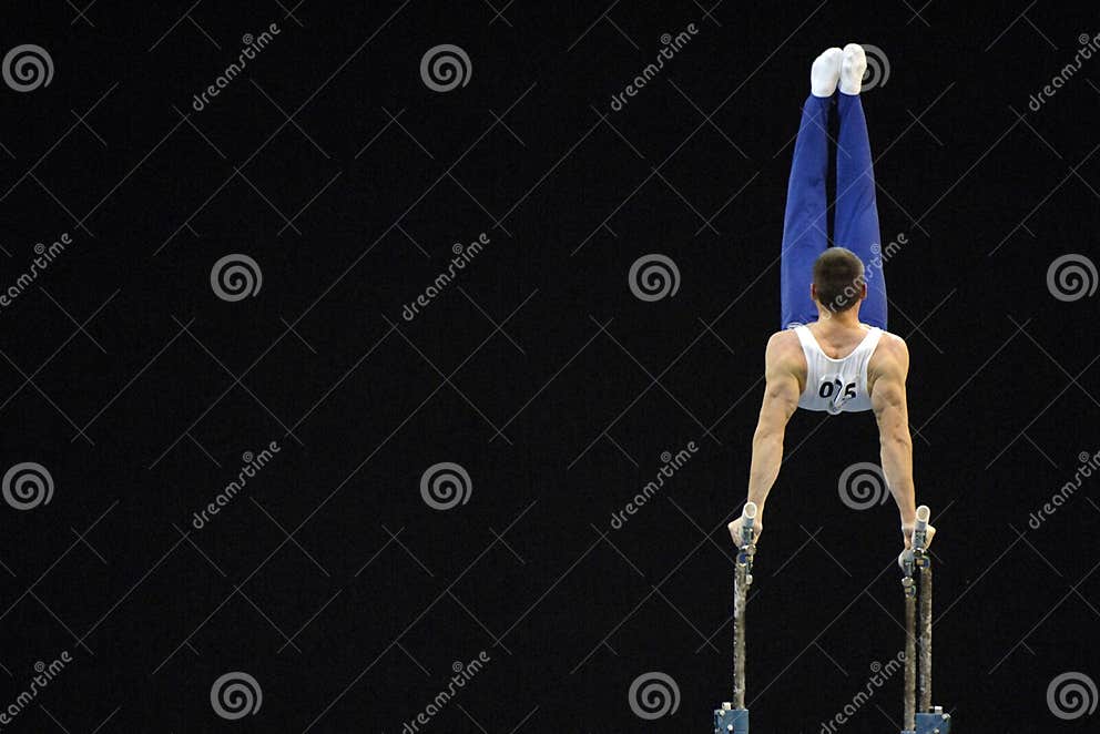 Parallel bars men2 stock photo. Image of muscles, bars - 1753258