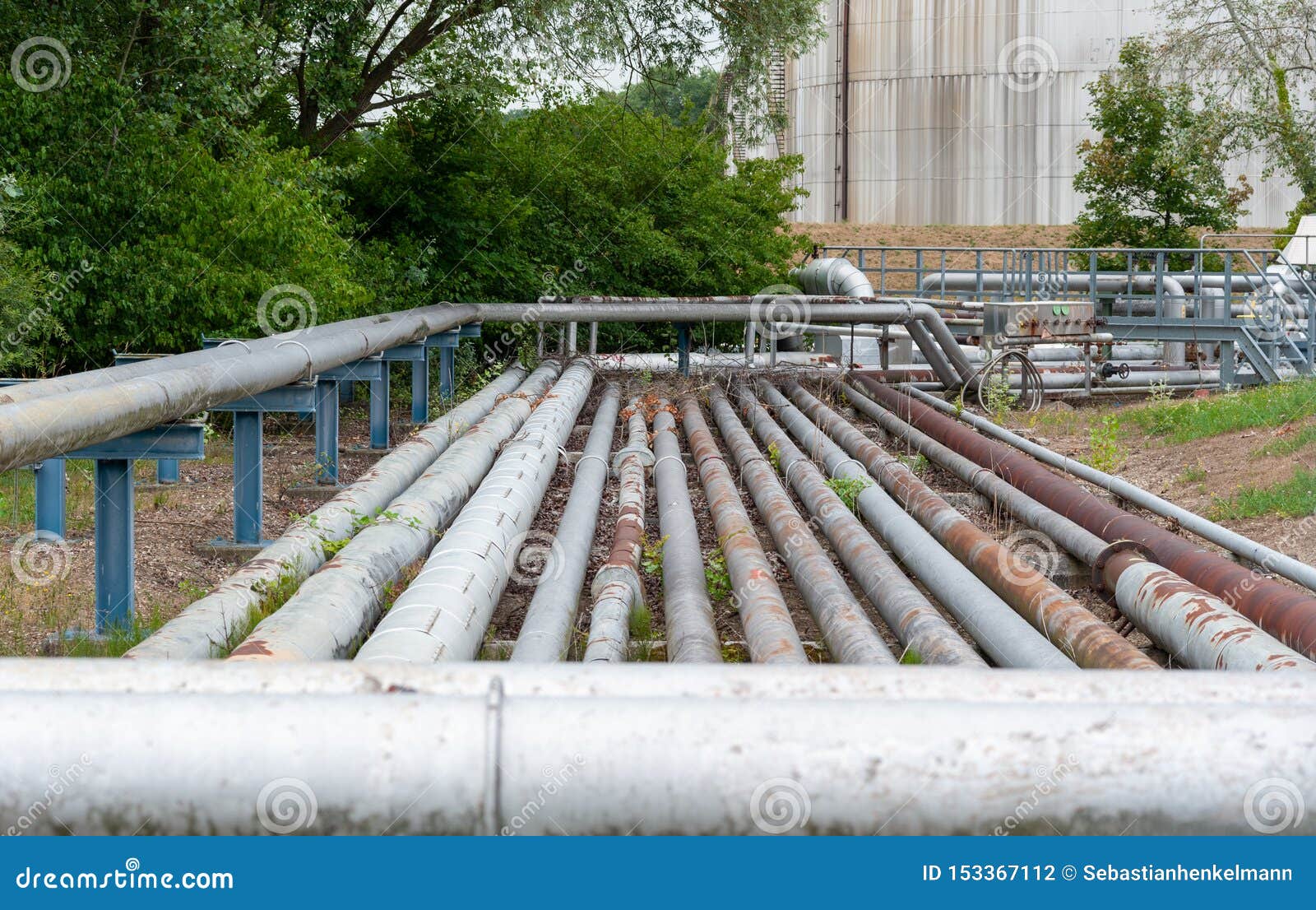 Parallel old rusty pipes stock photo. Image of supply - 153367112