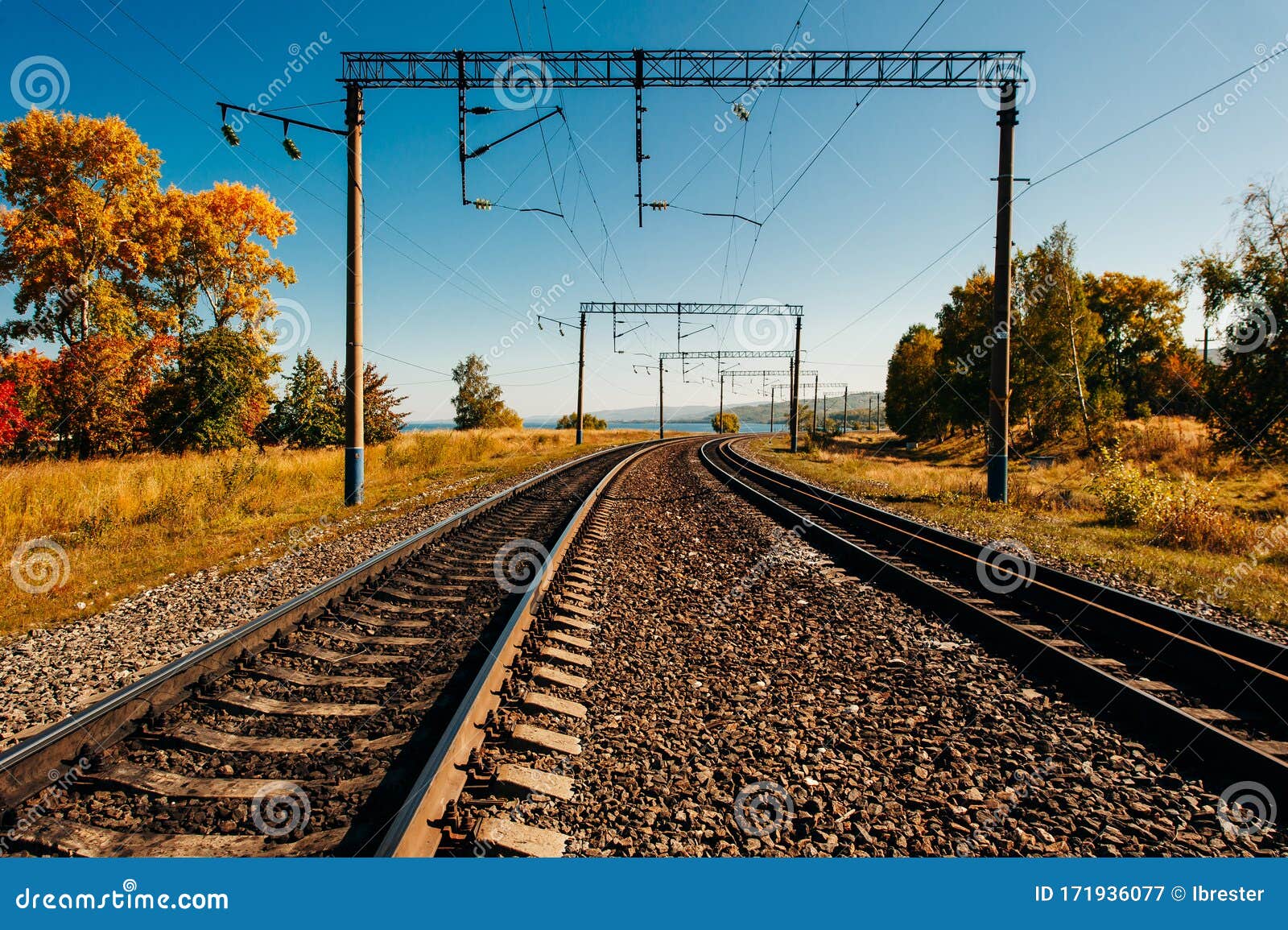 Parallel Railway Tracks and Overhead Lines through the Forest. Autumn ... Parallel Railway Tracks and Overhead Lines through the Forest. Autumn ...