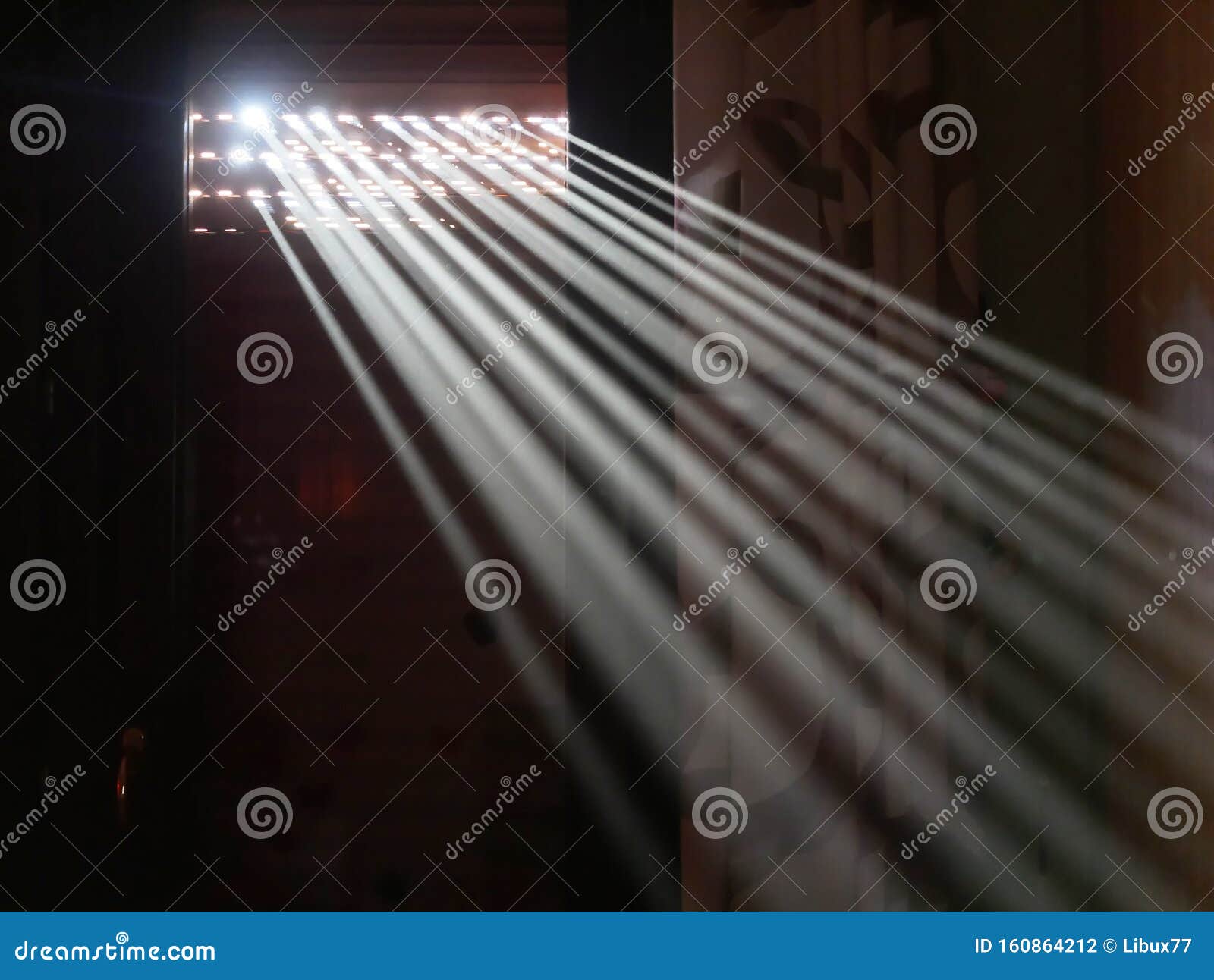 Parallel Rays of Light Effect Across Window Shutter Holes in the ...