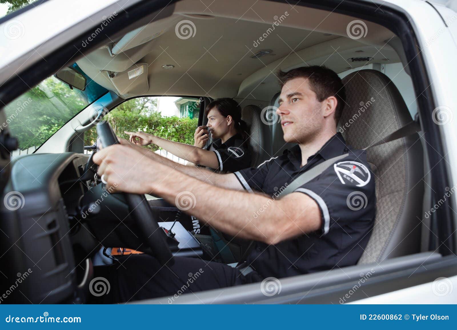 Paramedic in Ambulance Talking on Radio Stock Photo - Image of ...
