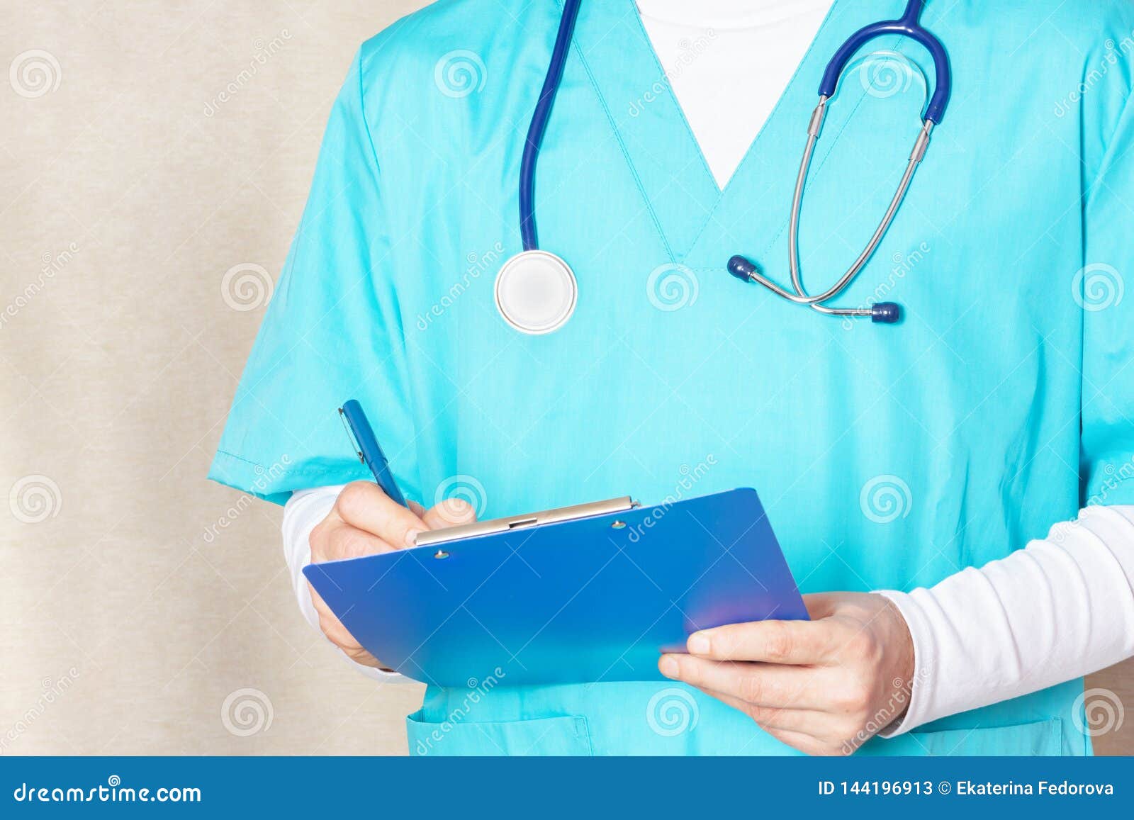 A Paramedic Does Write Something with a Pen in a Notebook. a Man in a ...