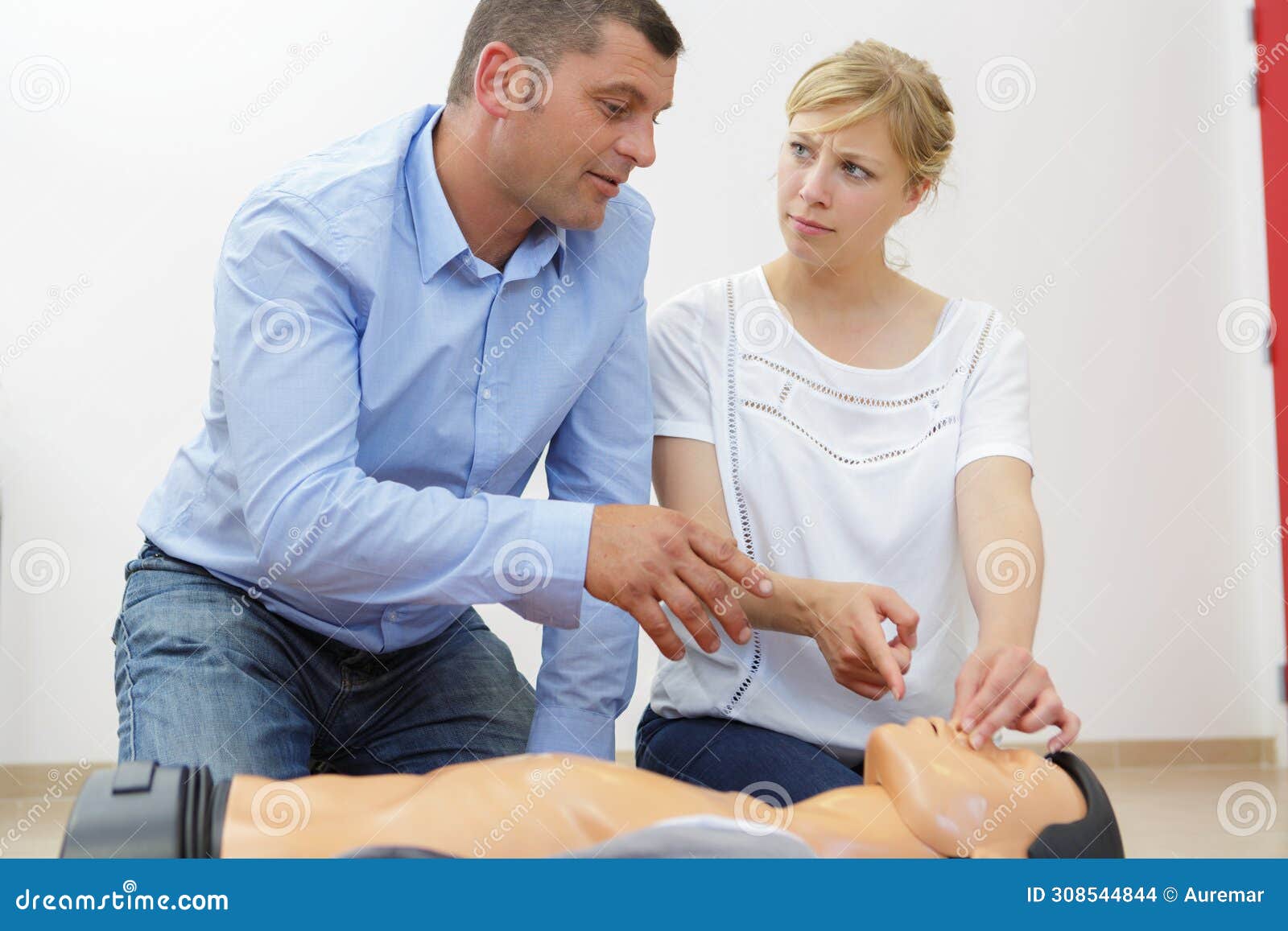 Paramedic Doing Chest Compression during Defibrillator Cpr Training ...