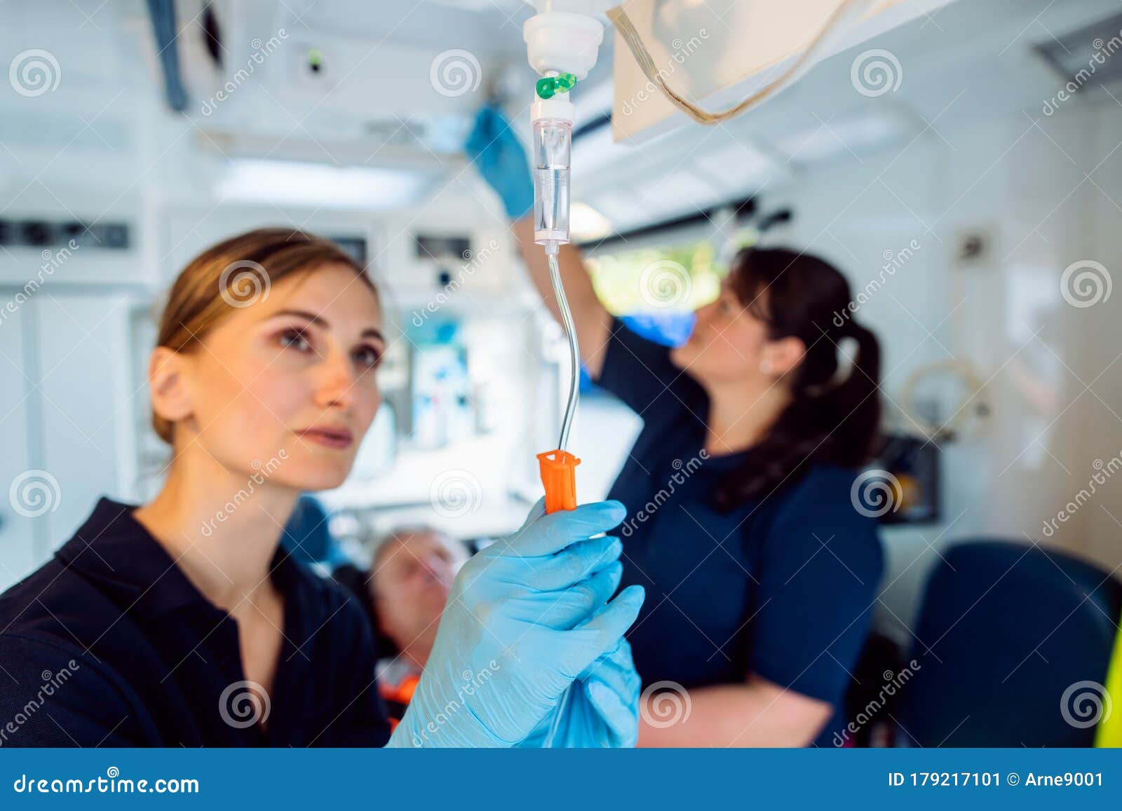 Paramedic Looking after the Drop Injection in an Ambulance Stock Image ...