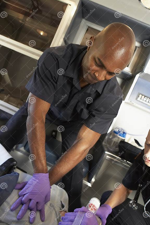 Paramedic Performing CPR on Patient Stock Image - Image of oxygen ...