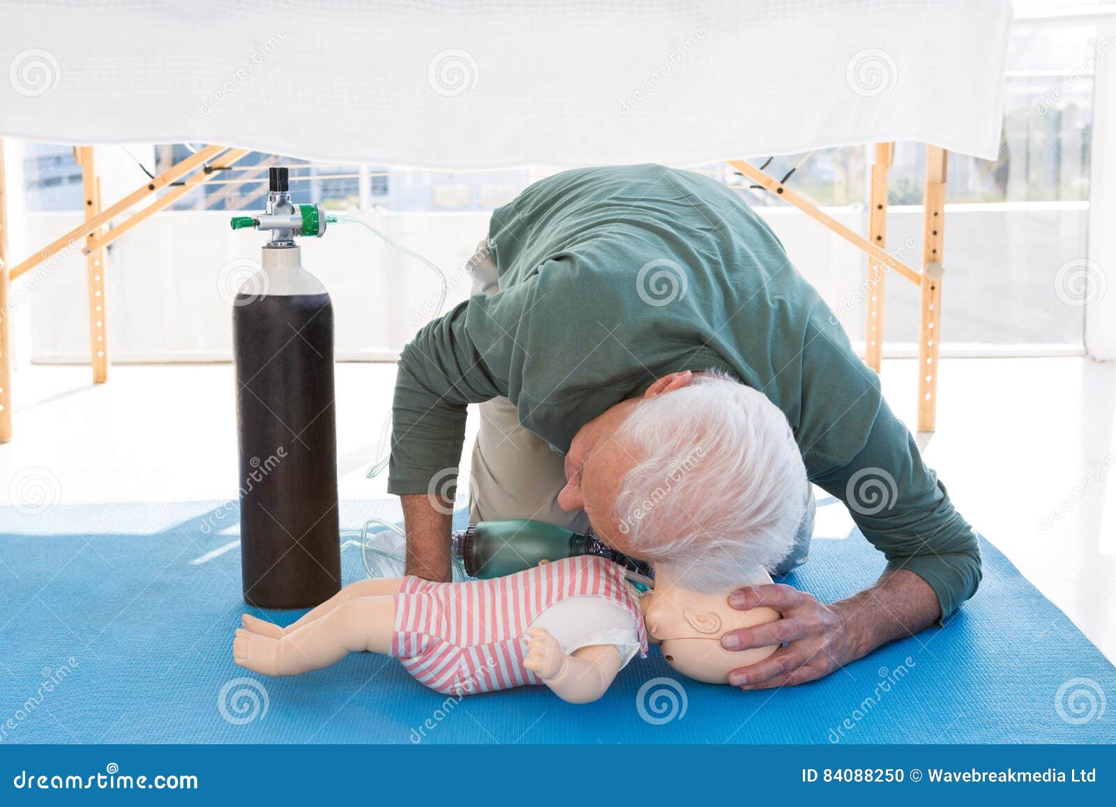 Paramedic Practicing Cardiopulmonary Resuscitation On Dummy Stock ...