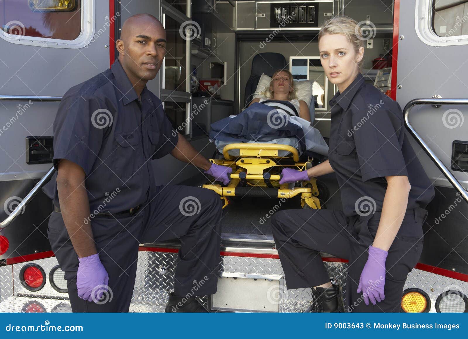 Paramedic Preparing To Unload Patient Stock Image - Image of horizontal ...