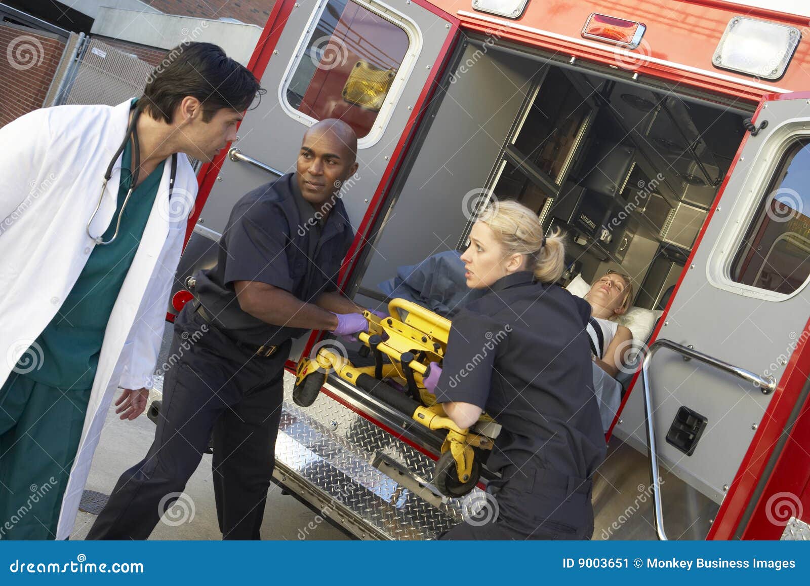 Paramedic Preparing To Unload Patient Stock Image - Image of quarter ...