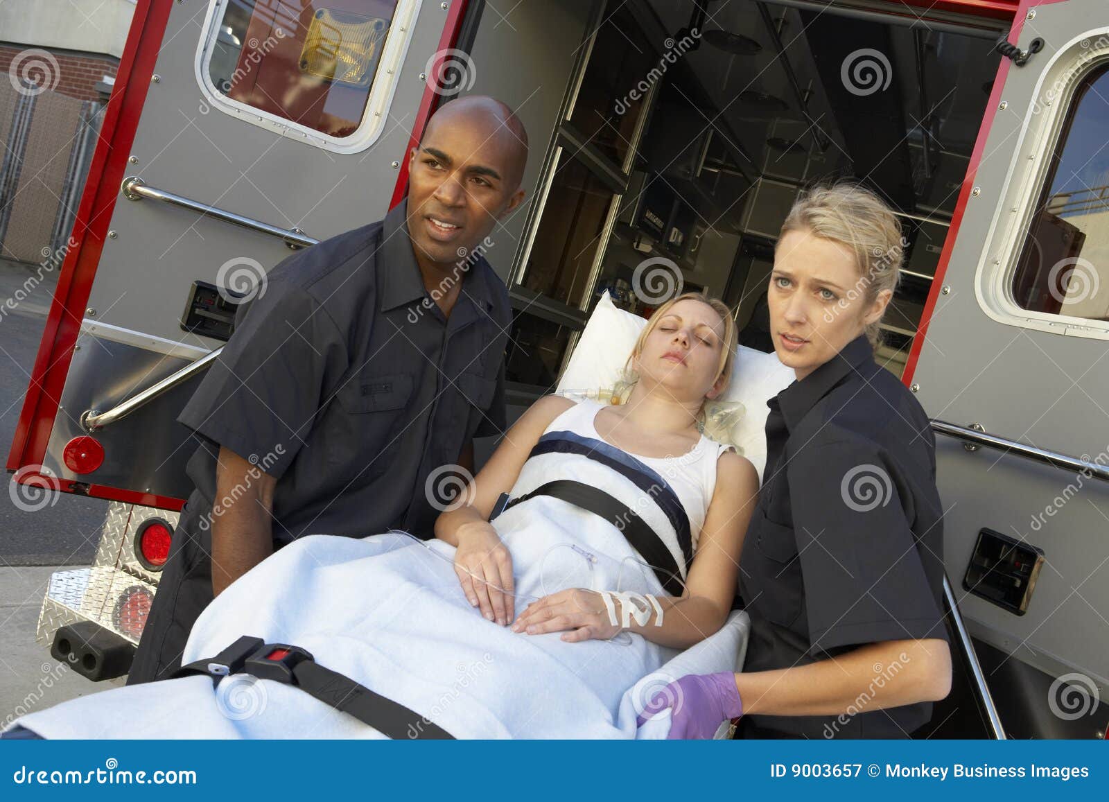 Paramedic Preparing To Unload Patient Stock Image - Image of length ...