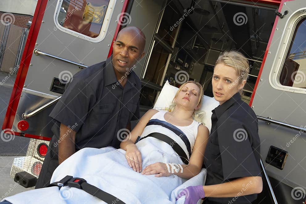 Paramedic Preparing To Unload Patient Stock Image - Image of length ...