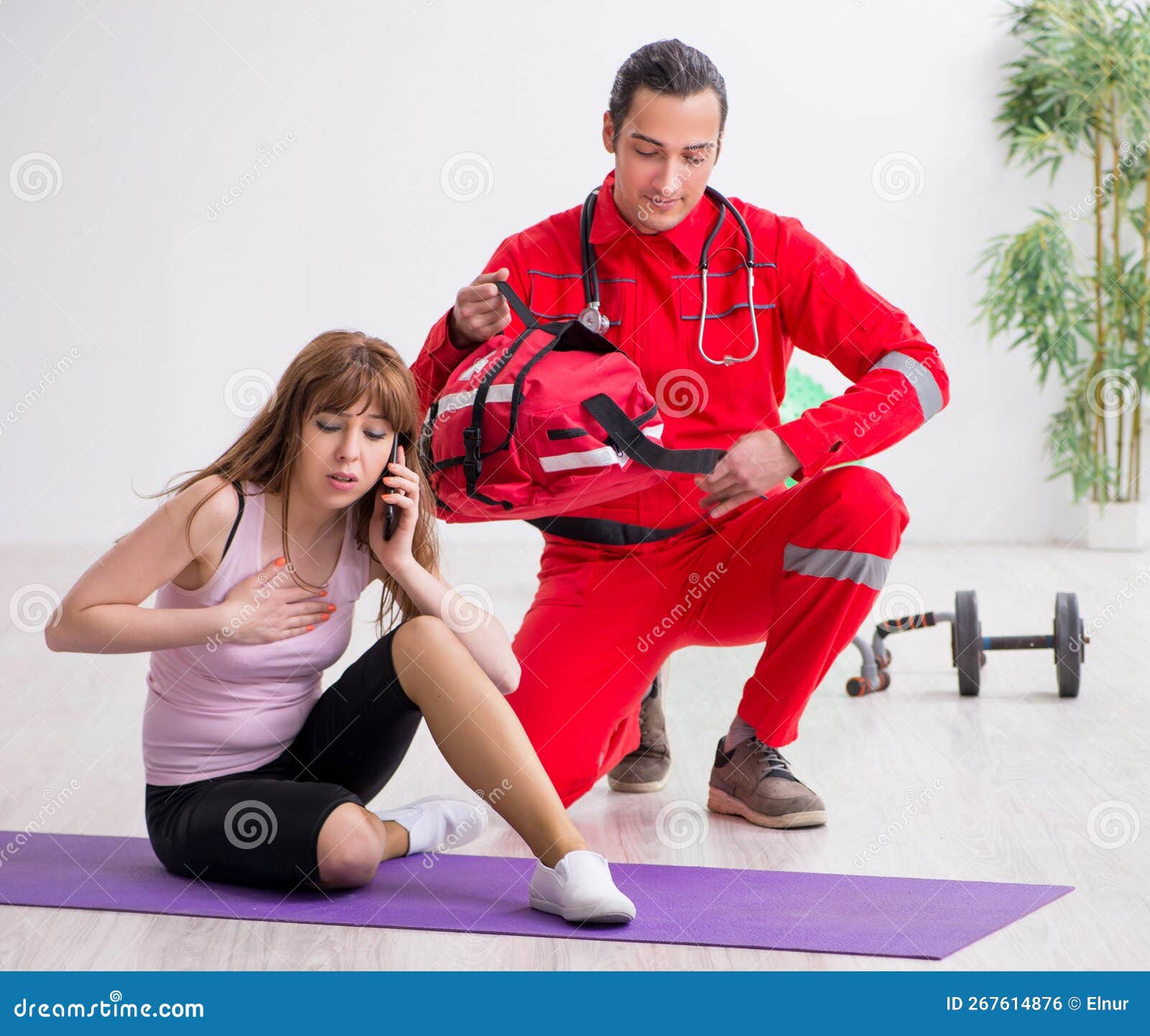 Paramedic in Red Visiting Young Woman in Gym Stock Photo - Image of health, disease: 267614876