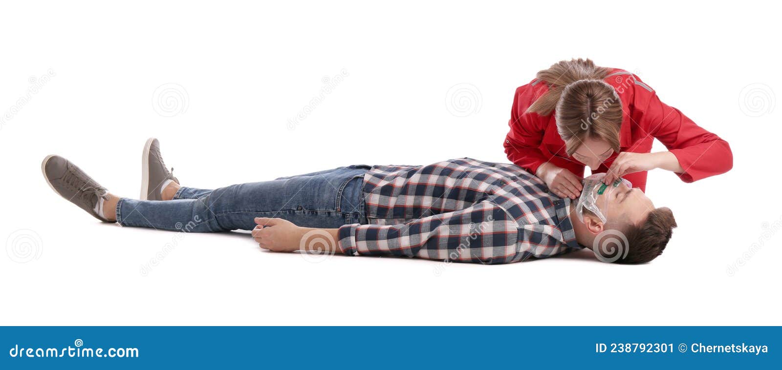 Paramedic in Uniform Performing First Aid on Unconscious Man Against ...