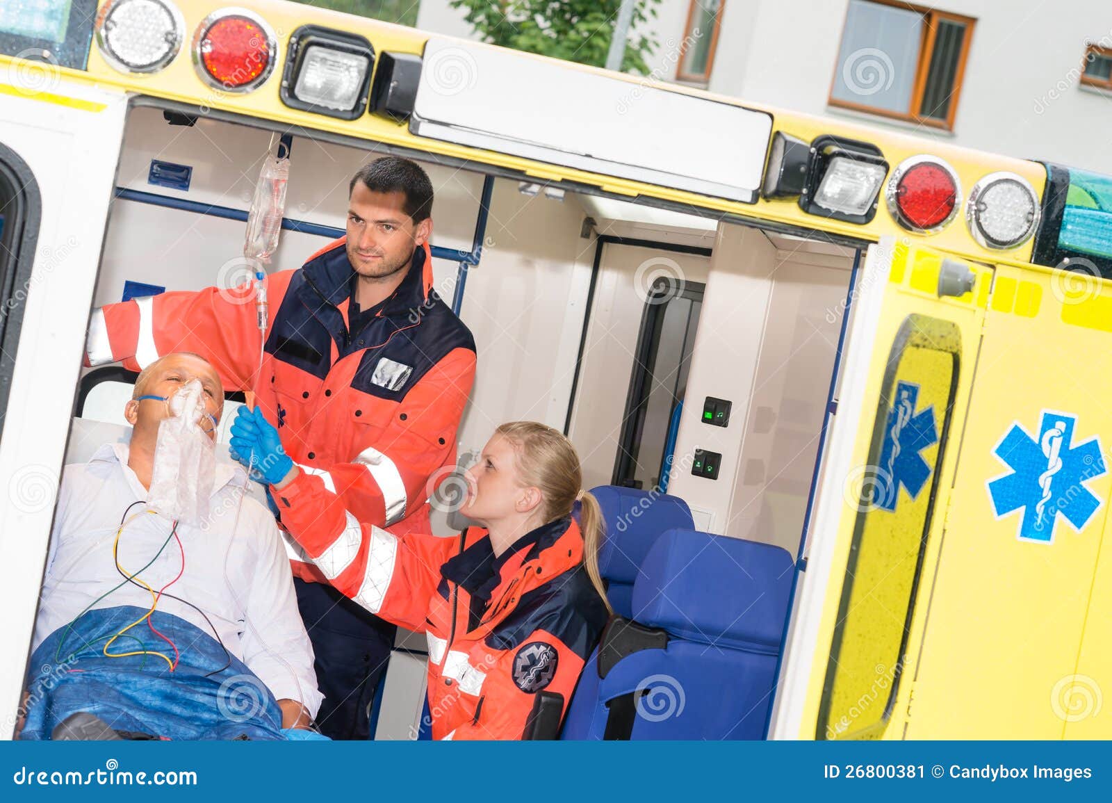 Paramedics Checking IV Drip Patient in Ambulance Stock Image - Image of ...