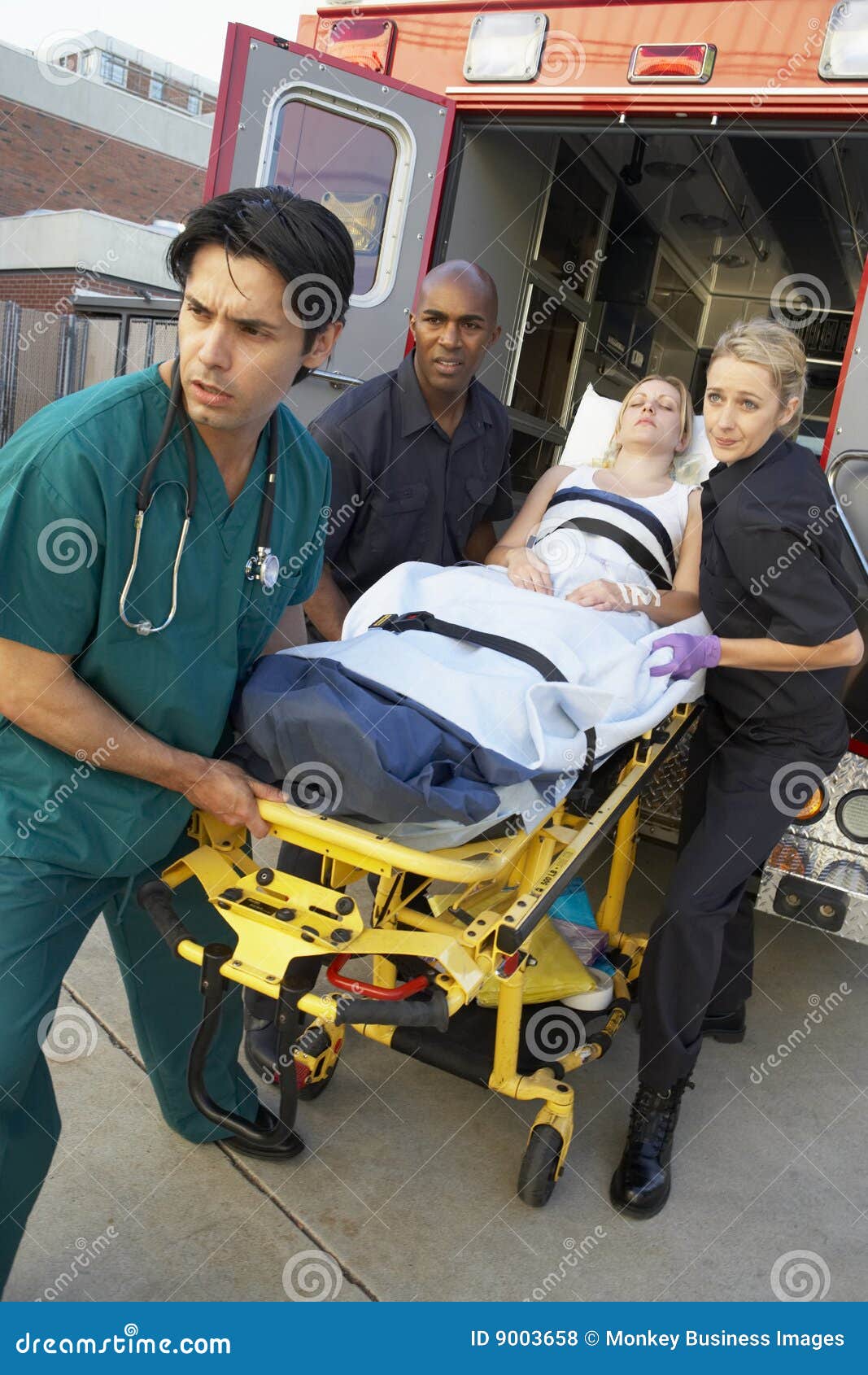 Paramedics and Doctor Unloading Patient Stock Photo - Image of people ...
