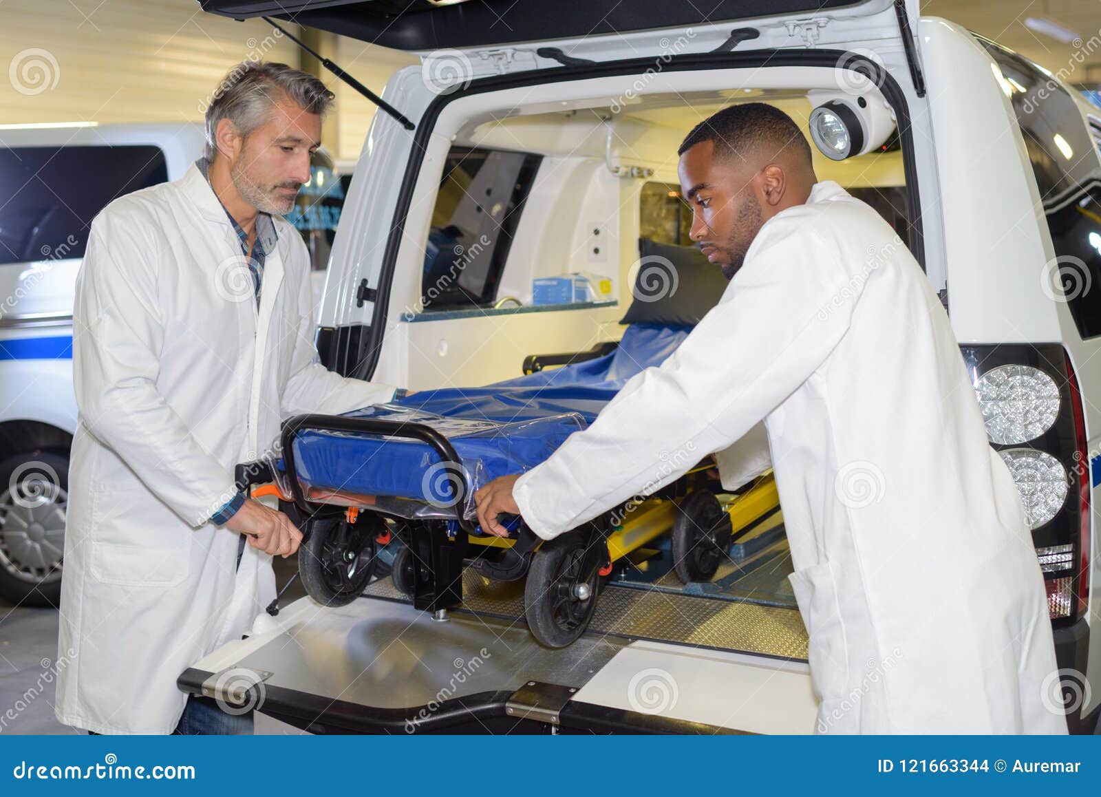 Paramedics folding the bed stock photo. Image of healthcare - 121663344