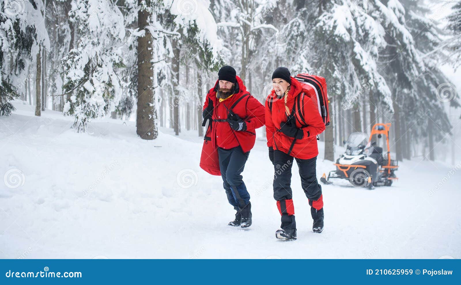 Paramedics from Mountain Rescue Service Walking Outdoors in Winter in ...