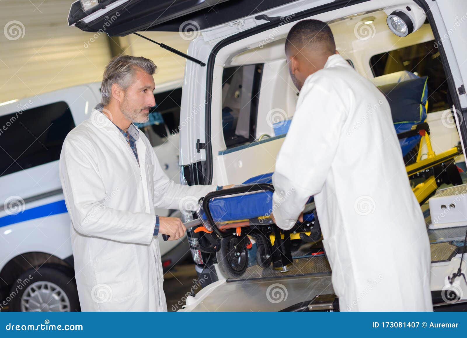 Paramedics Putting Patient In Ambulance Car Aid Royalty-Free Stock ...