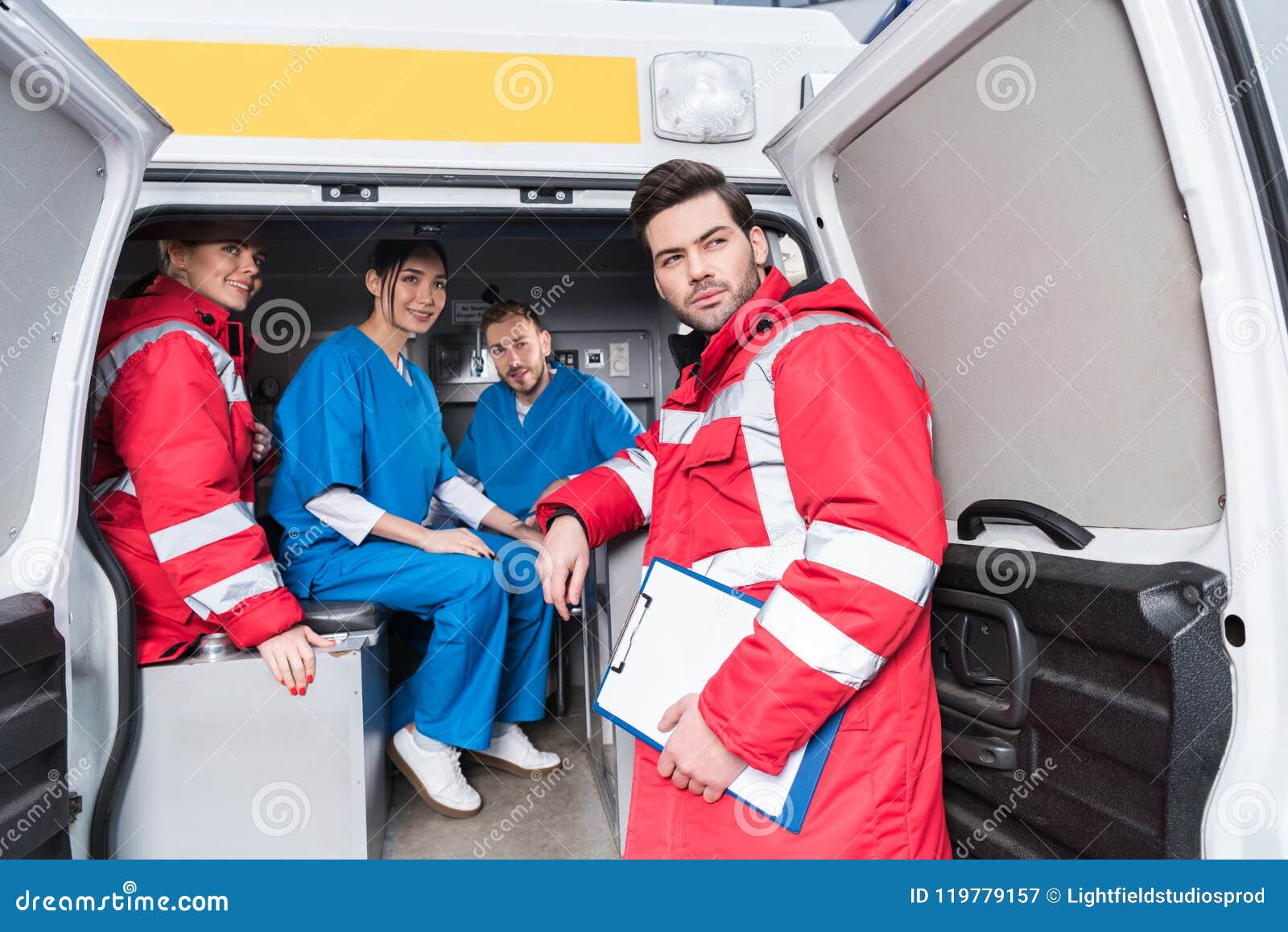 Paramedics Working Team Smiling Stock Image - Image of female, copy ...