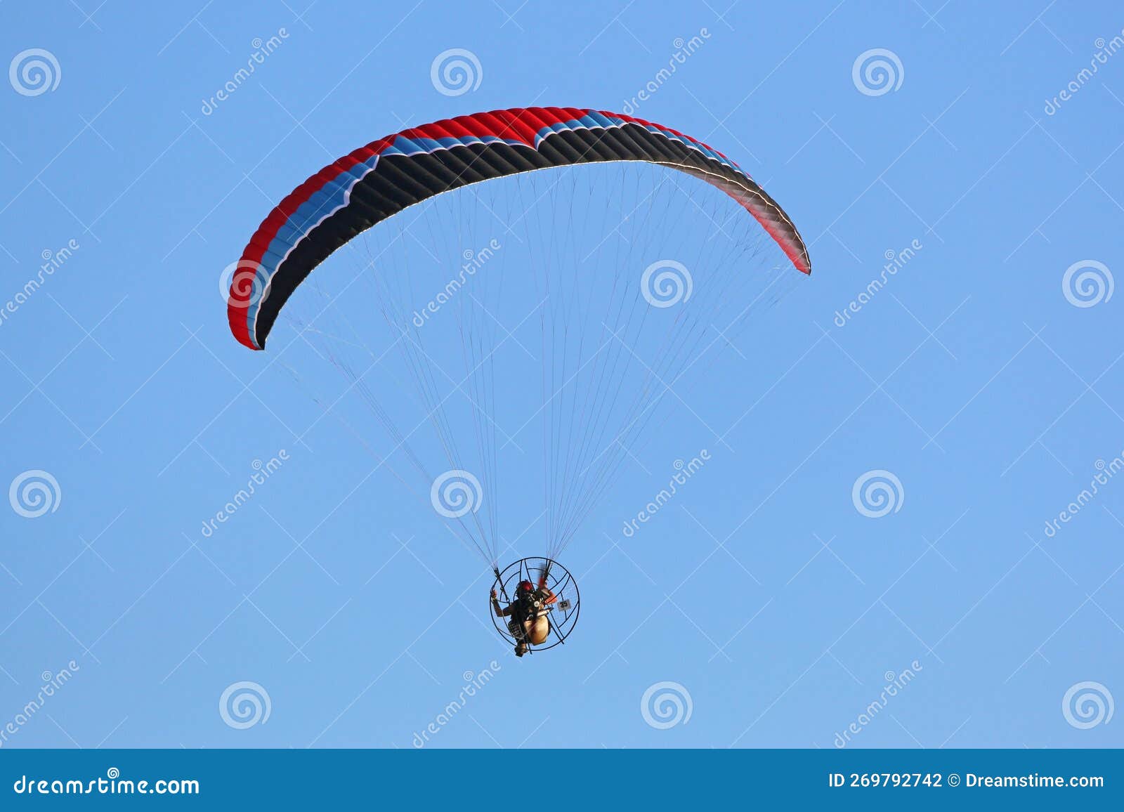 Paramotor Pilot Flying in a Blue Sky Stock Photo - Image of transport ...
