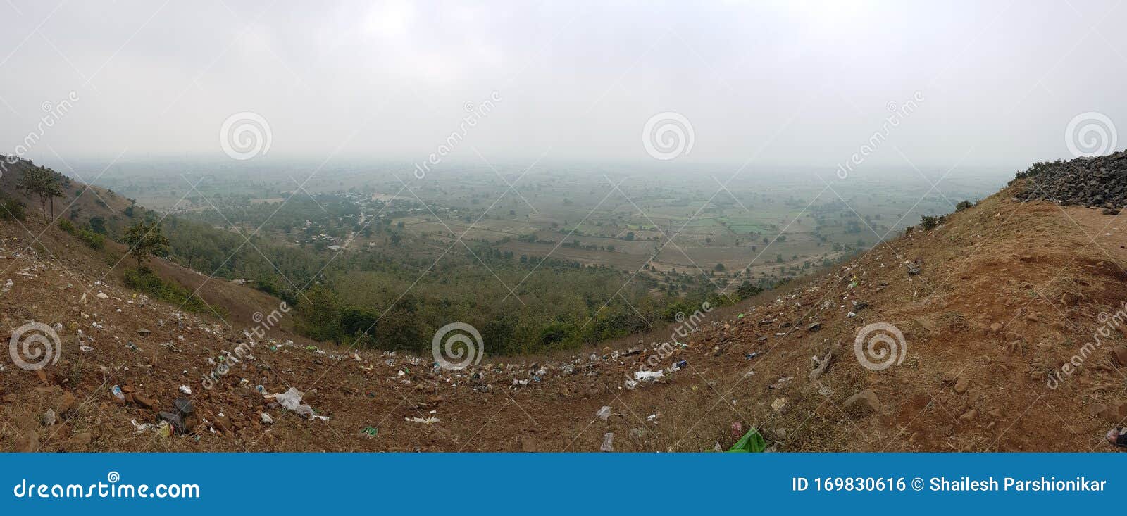 Paranomic View of a Valley with Foggy Clouds and Green Fields Stock ...