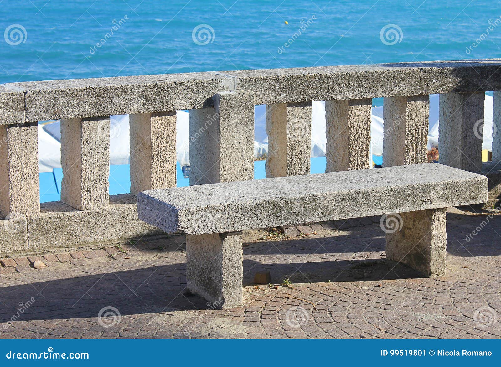 Parapet and Bench in Front of the Sea Stock Image - Image of tiles ...