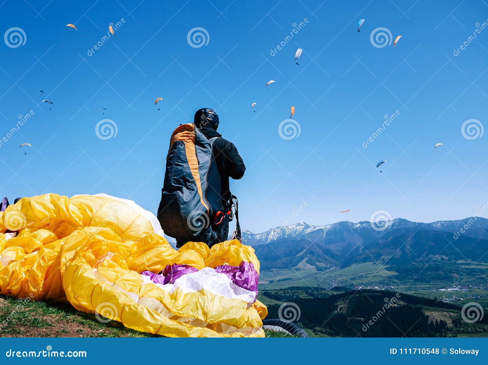 Paraplanner in Full Equipment for Flight Looks on Soaring Another ...