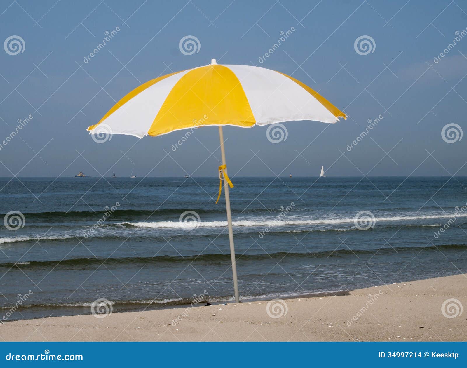 Parasol on the beach stock photo. Image of seawater, sand - 34997214